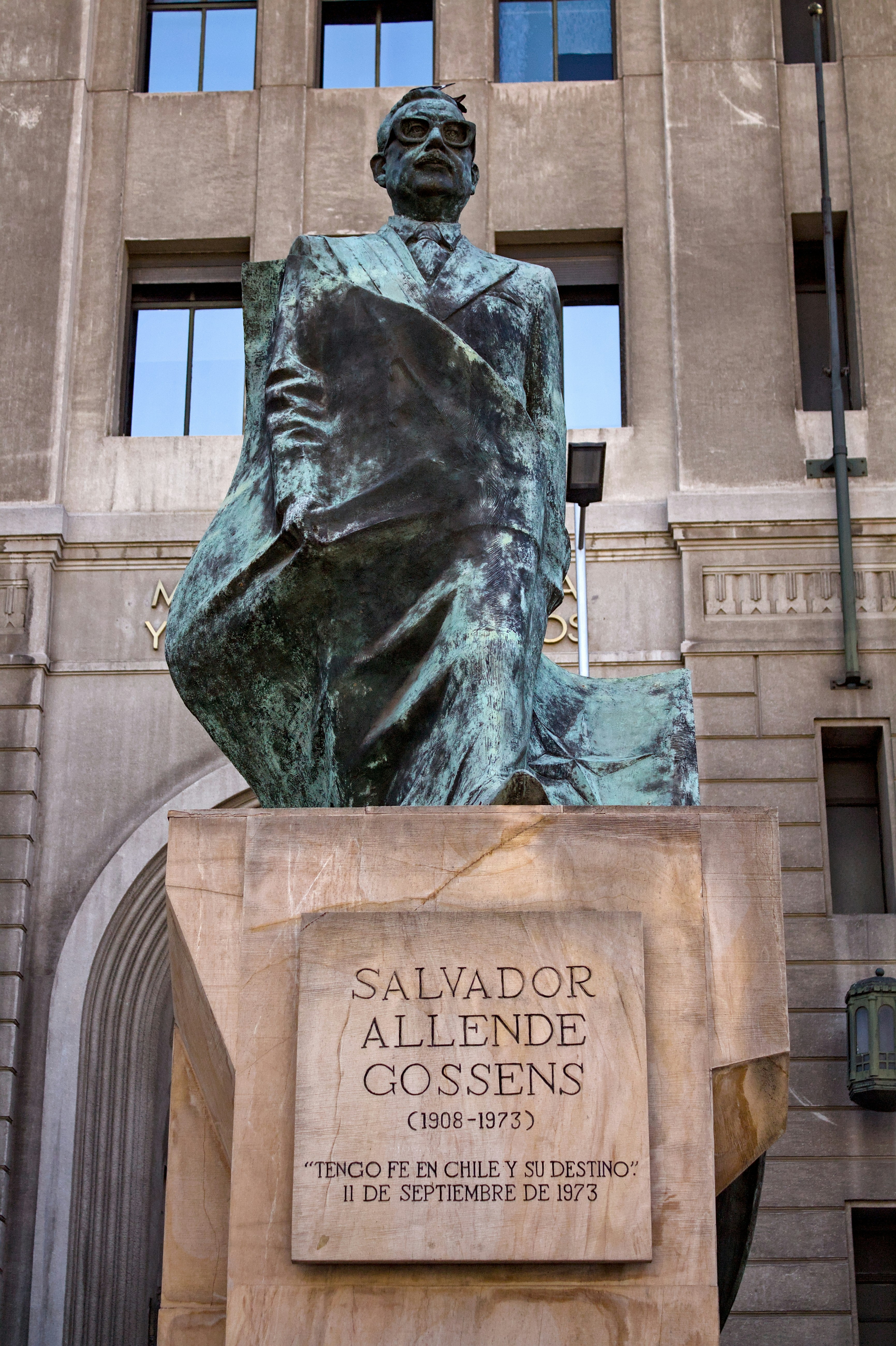 Bronzed Scholar: Salvador Allende Gossens Watchful in Front of the Stone Pedestal
