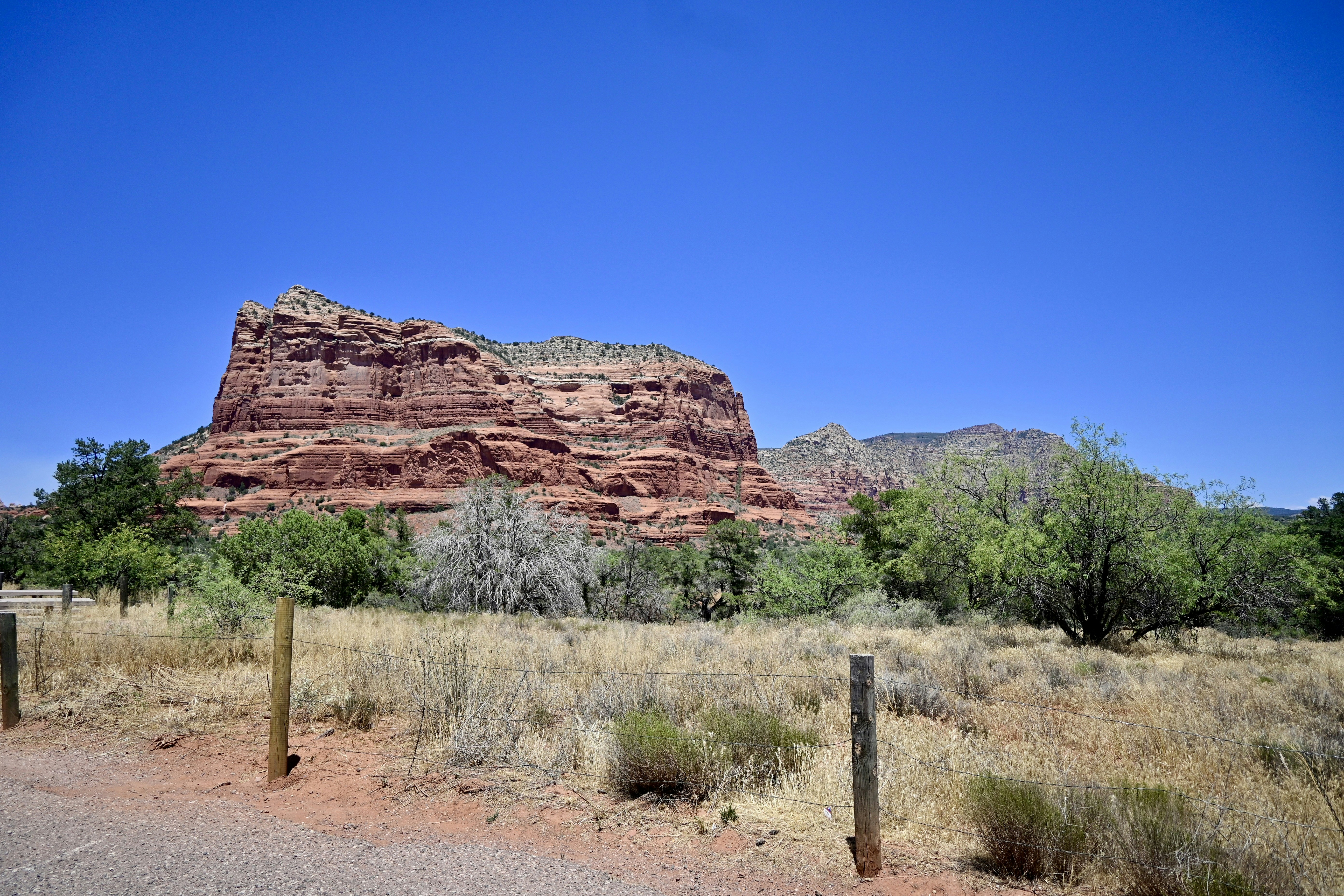 Red Mesa Sentinel Over a Dusty Plain