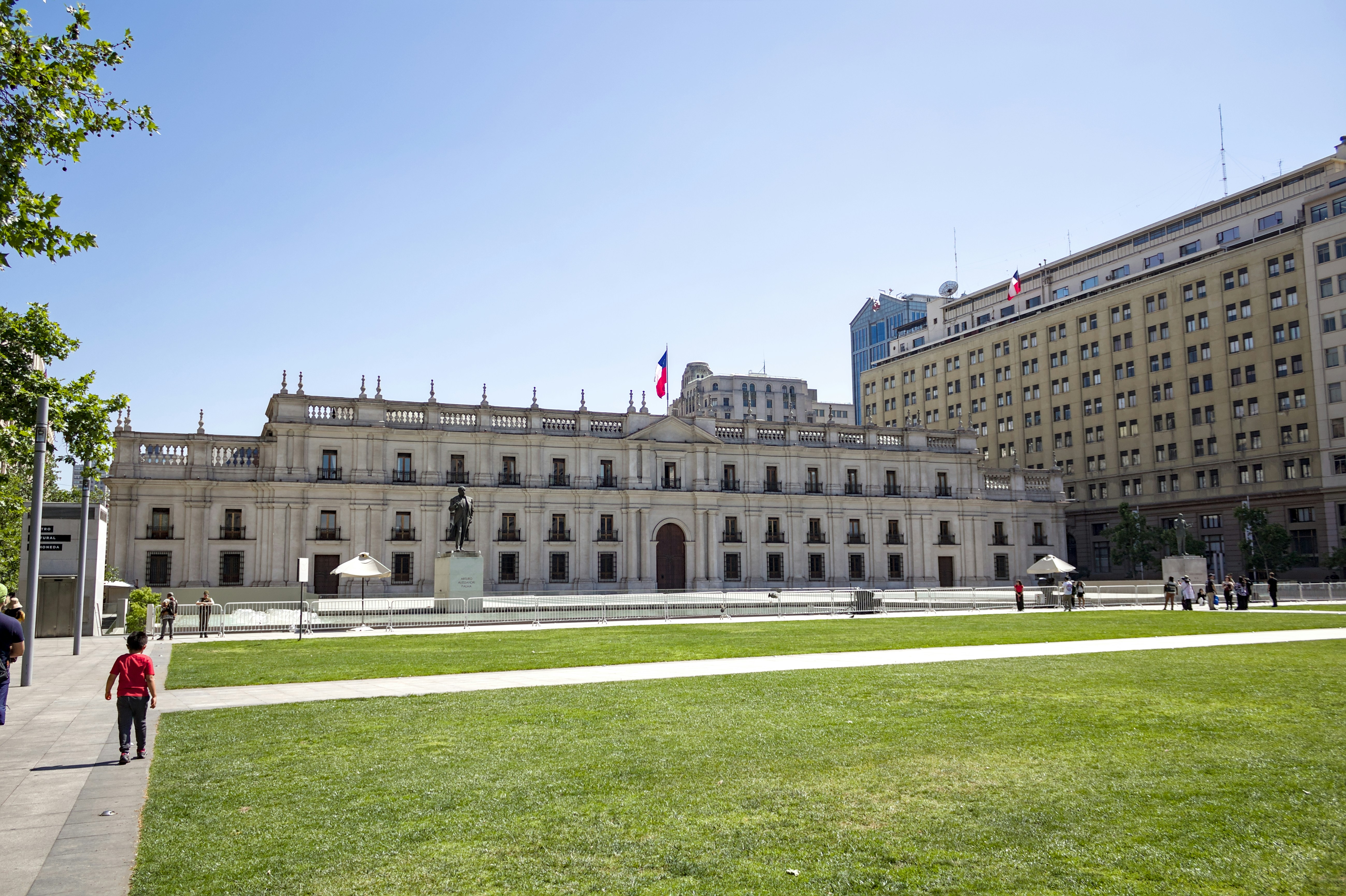 Lawn, Sunlit Steps, and the Flagged Facade