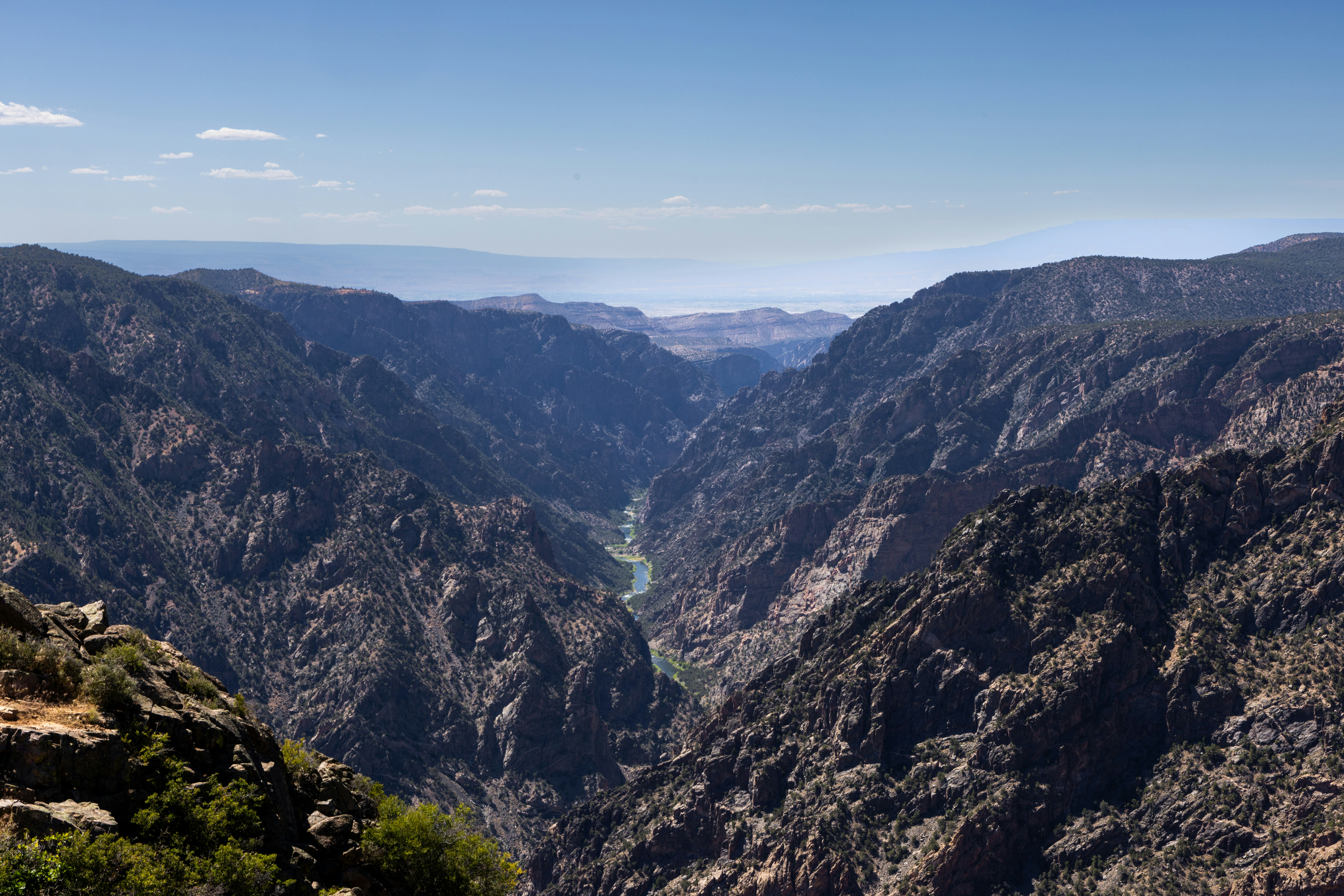 A Silent Gorge Descends: Canyon Walls Framing a Narrow River Ribbon