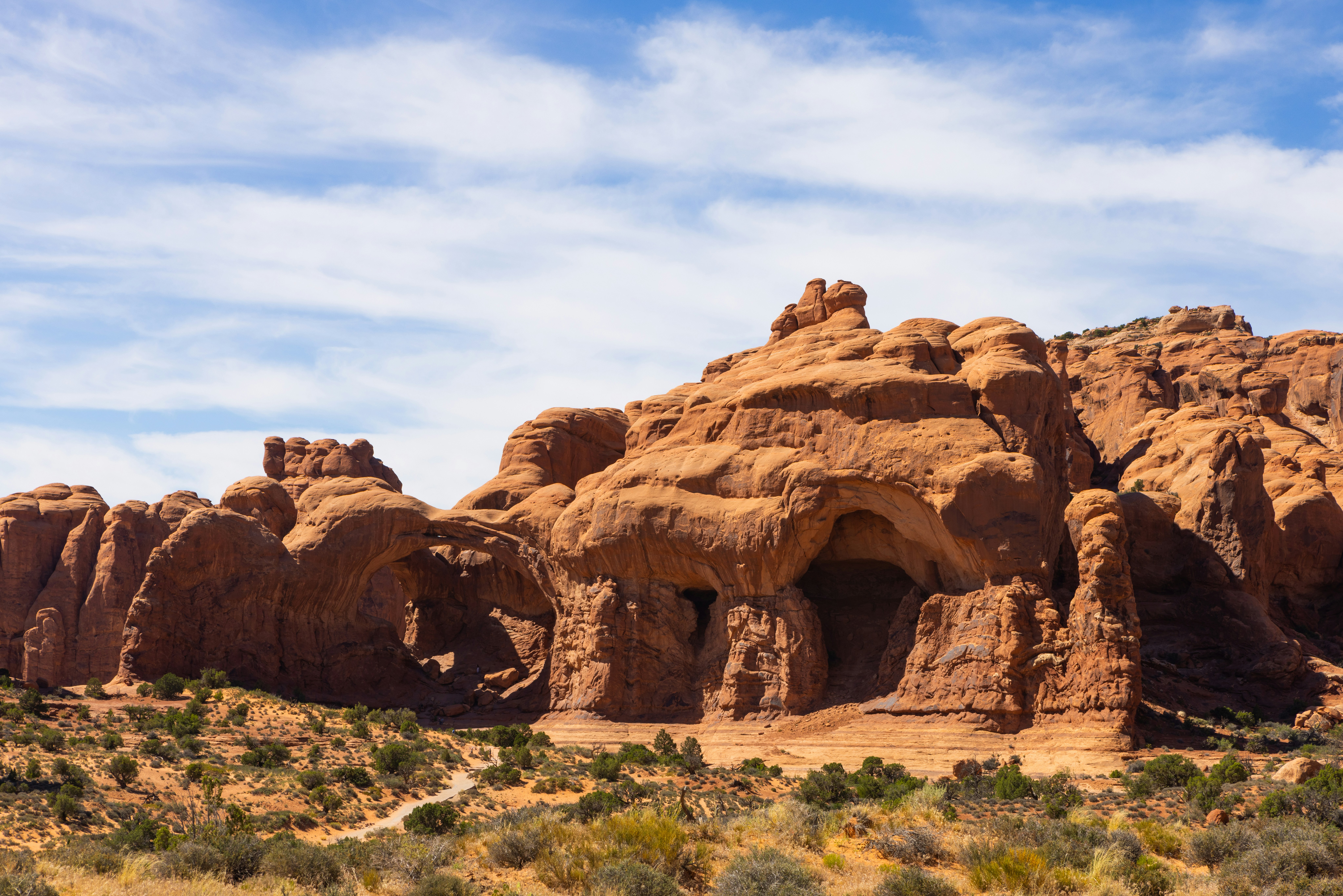 Desert Archforms: Sunlit Red Rock Domes Emerge from Sparse Scrub