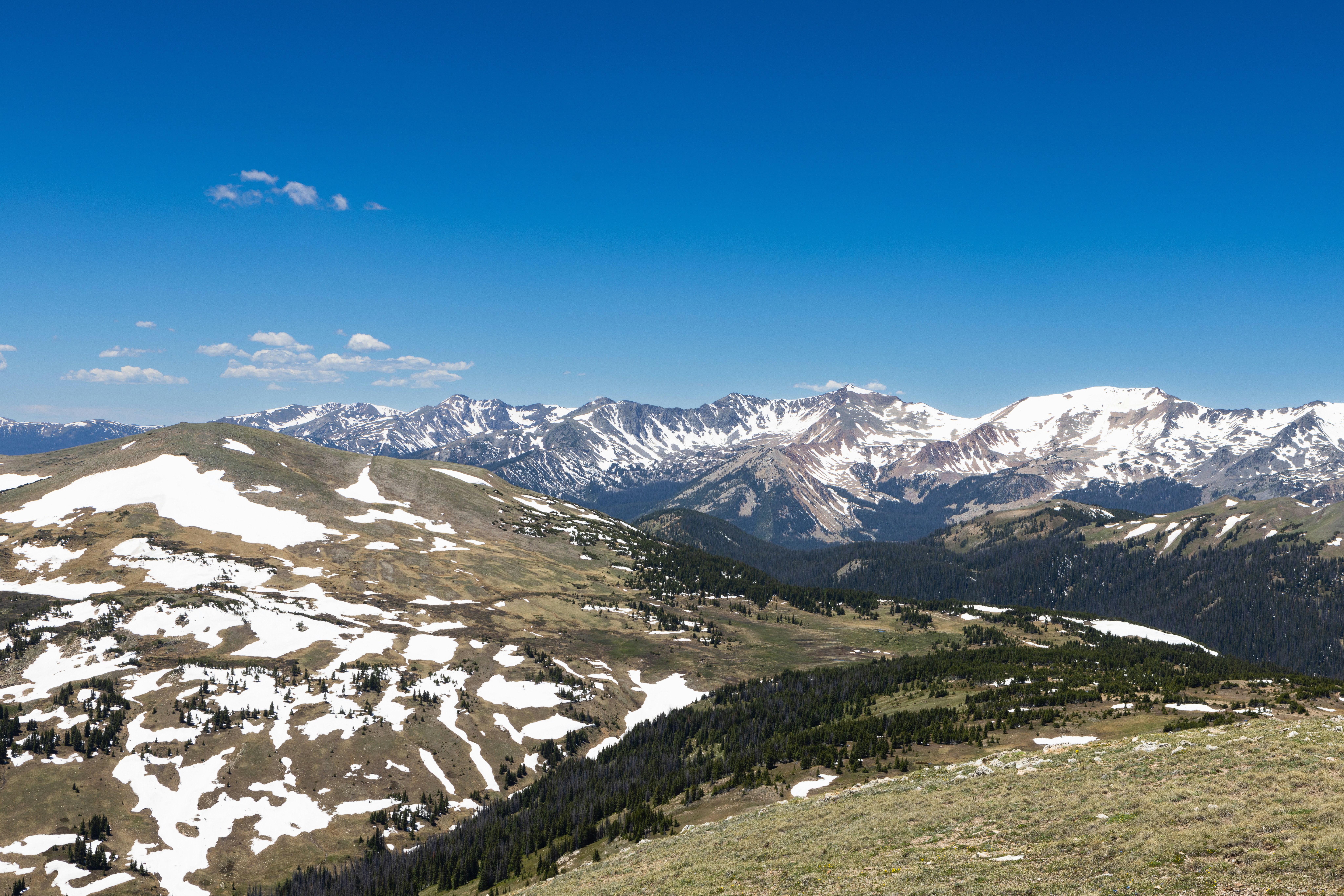 Snow-dusted ridges under a crisp alpine sky