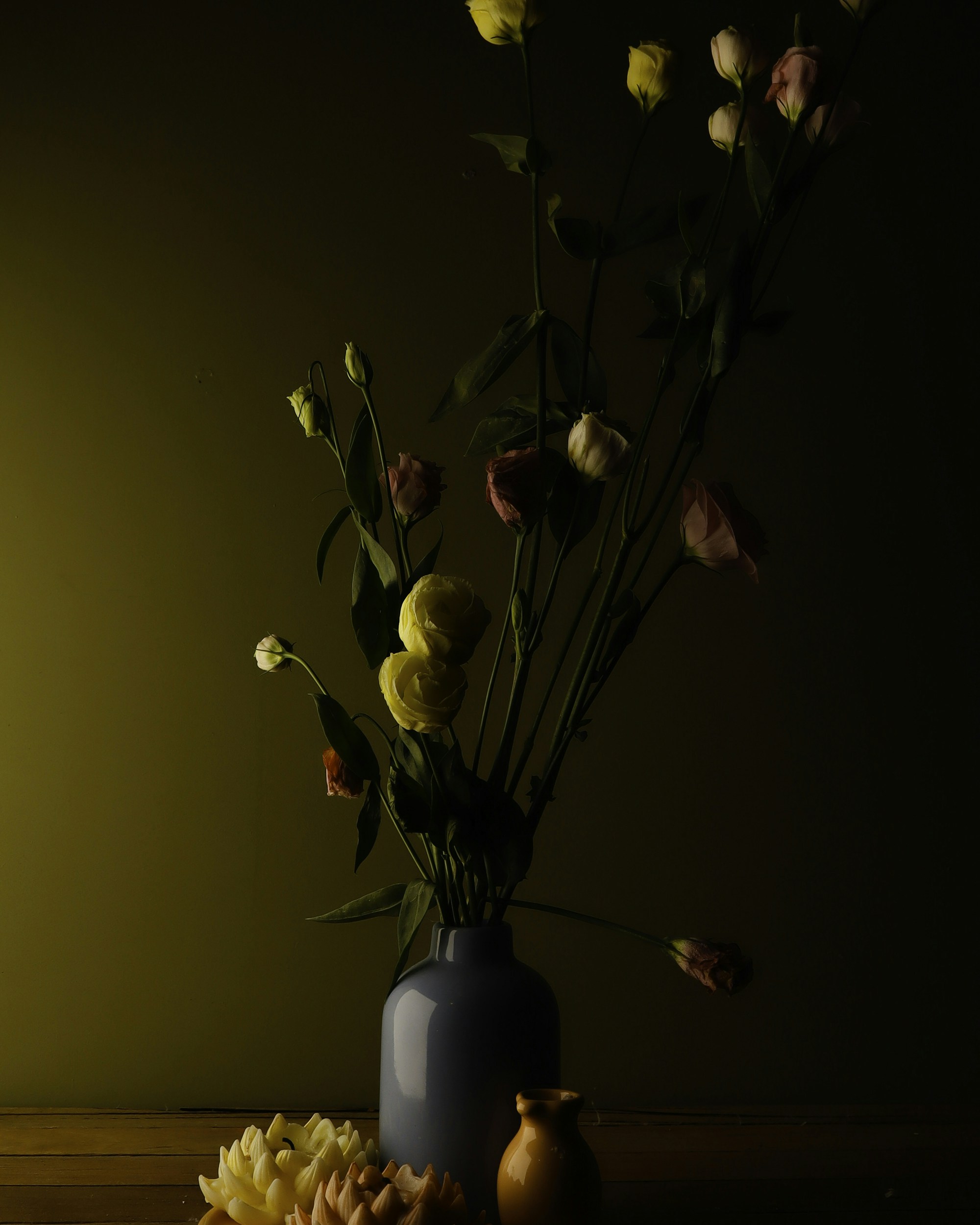 Stems in a Quiet Glow: A Vase of Roses and Buds