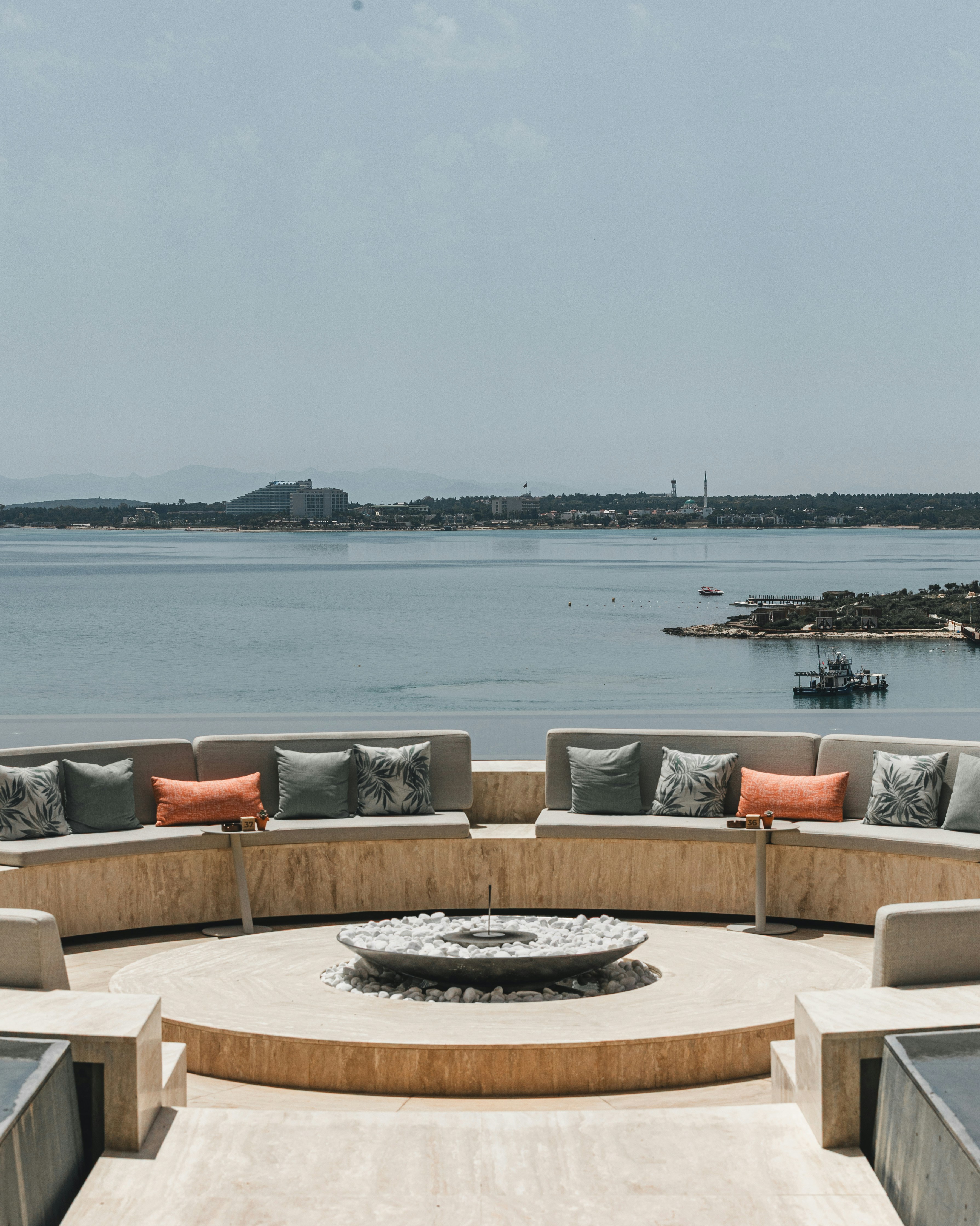 Circular Fire Pit Embraced by Sea-View Lounge