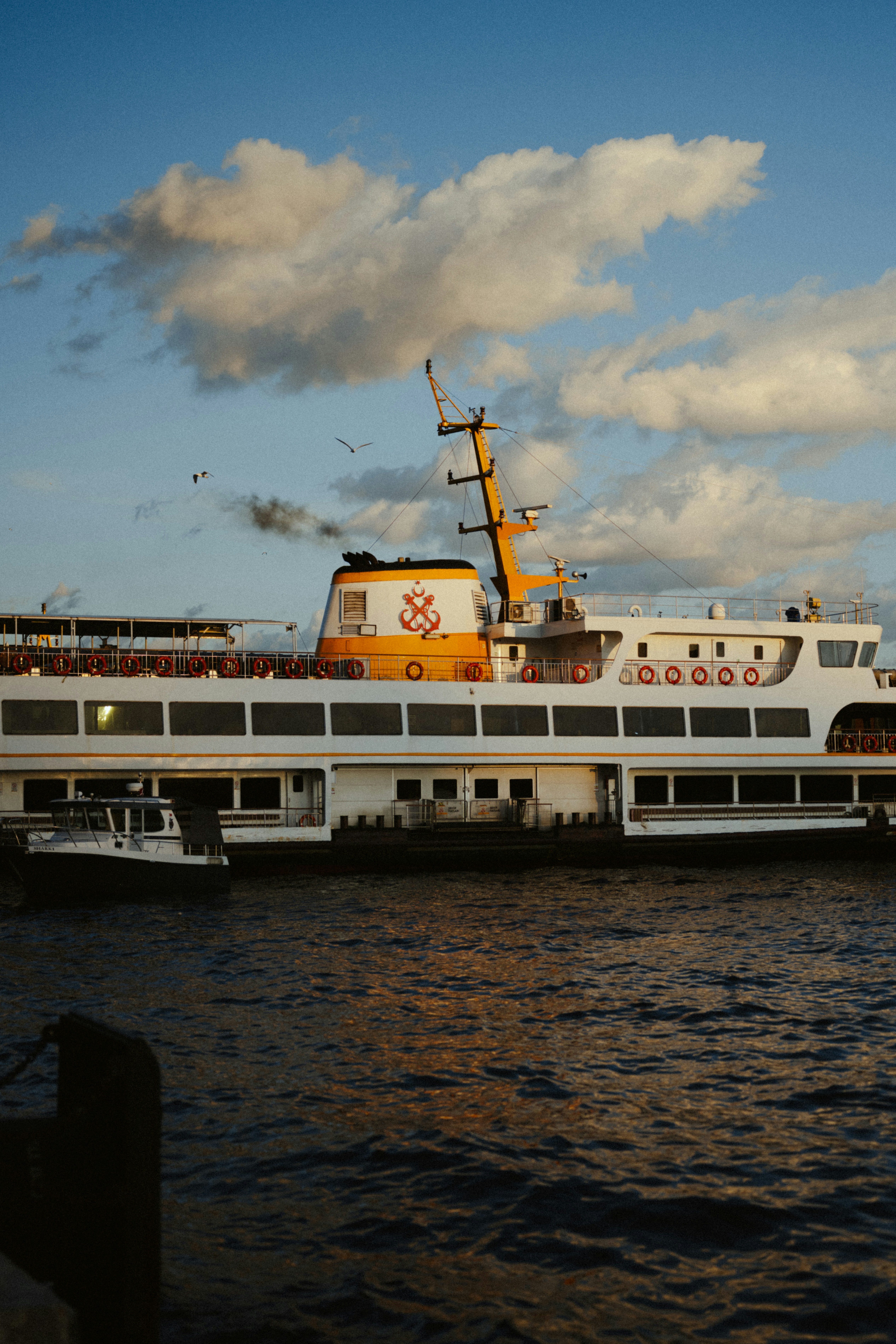 Azure Vessel: A Quiet Moment with a Decorative Ferry Docked at Dusk
