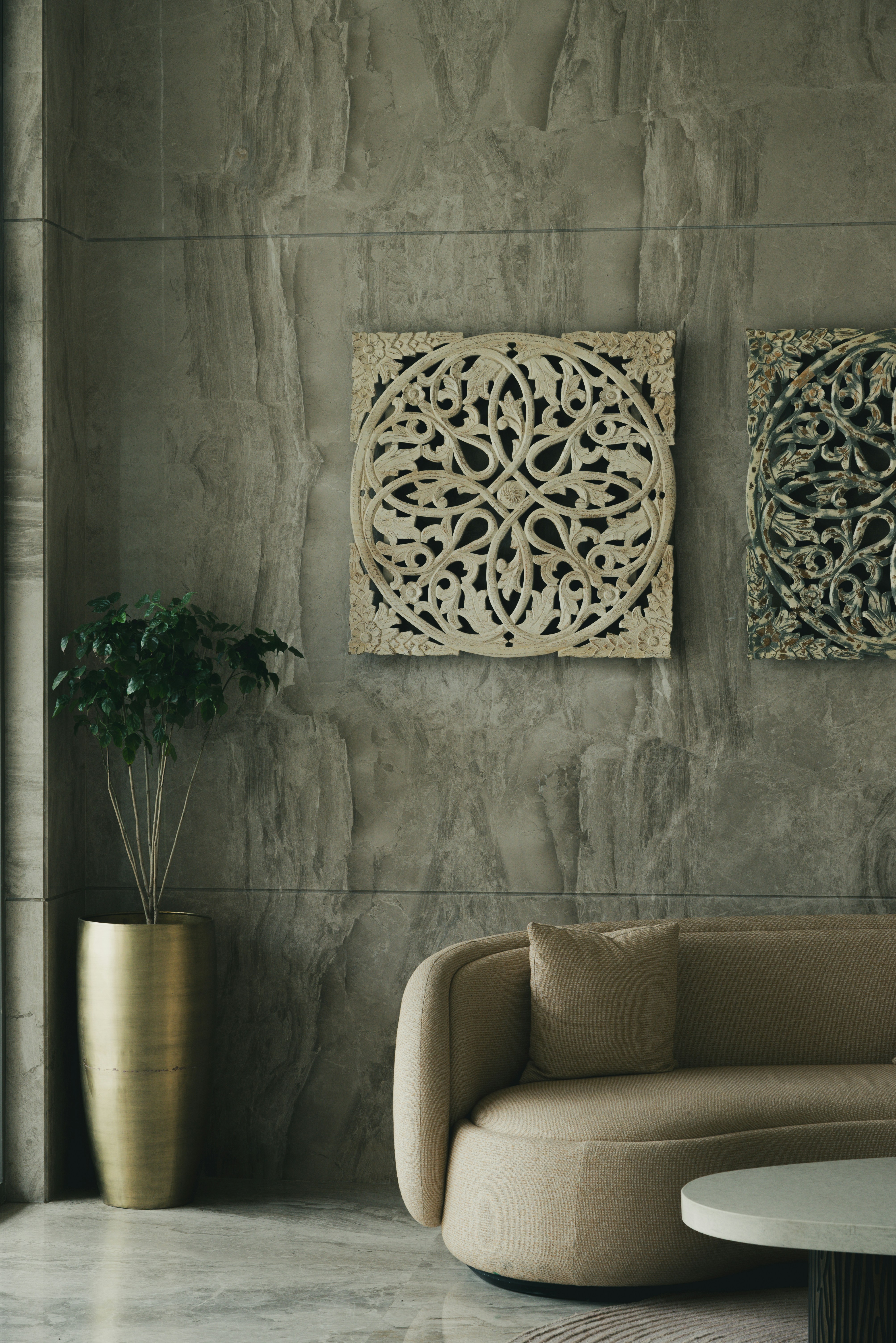 Modern Calm: Concrete Texture, Sculpted Panels and Plush Corner