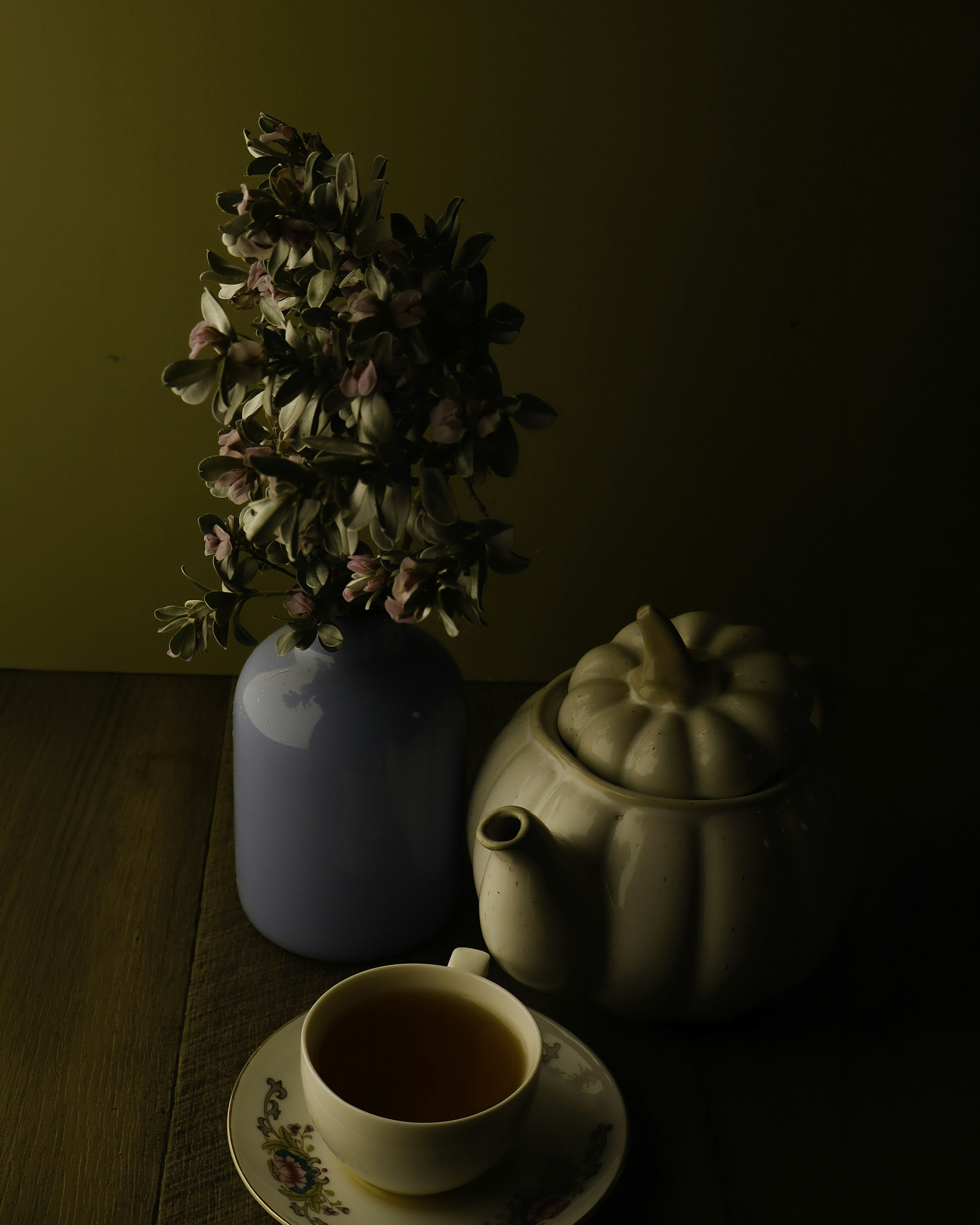 Muted Still Life: Floral Vase and Pumpkin Teapot in Low Light