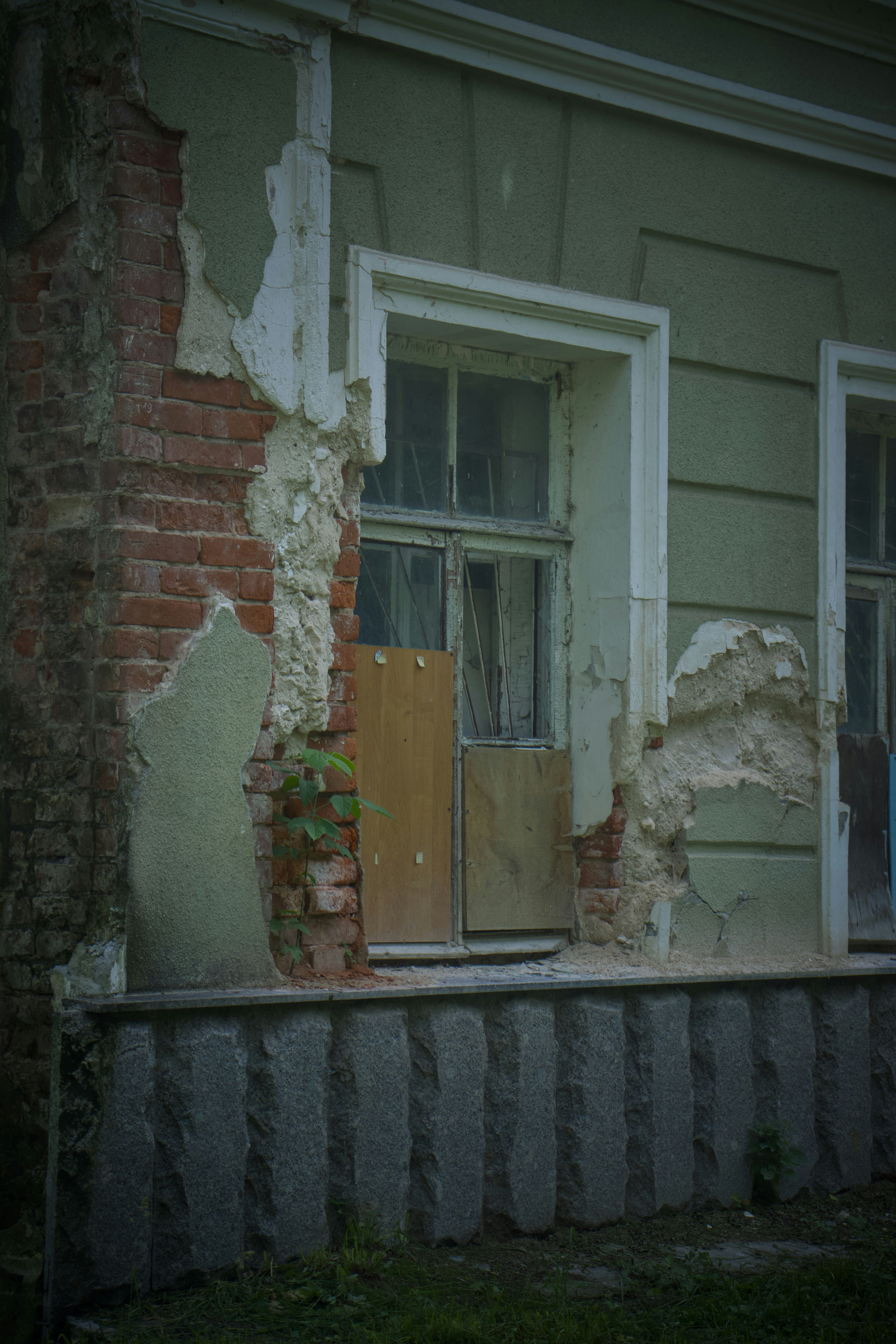 Cracked Facade and Boarded Window: A Silent Testimony of Decay