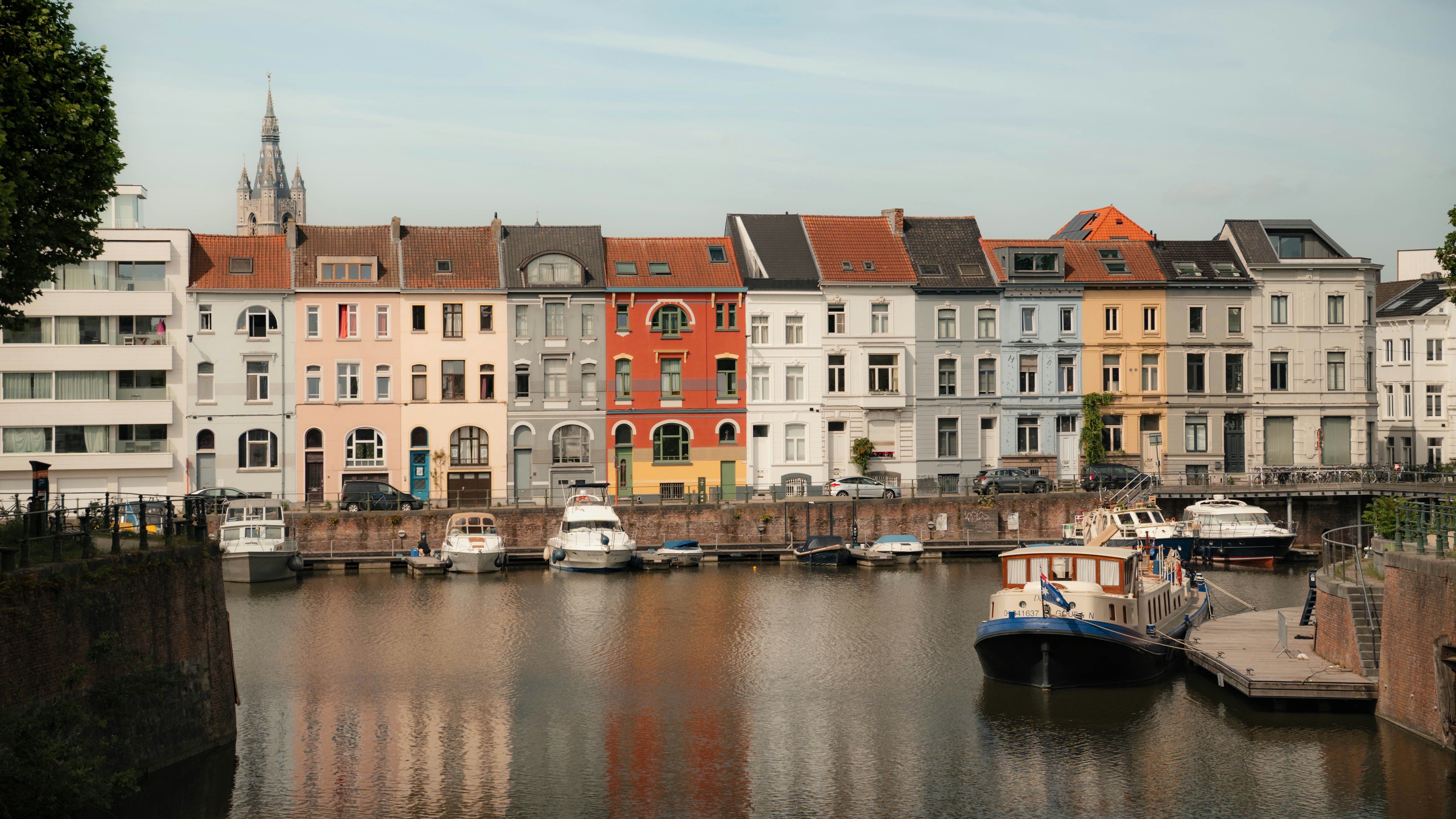 Colorful Row of Townhouses Framed by a Calm Canal