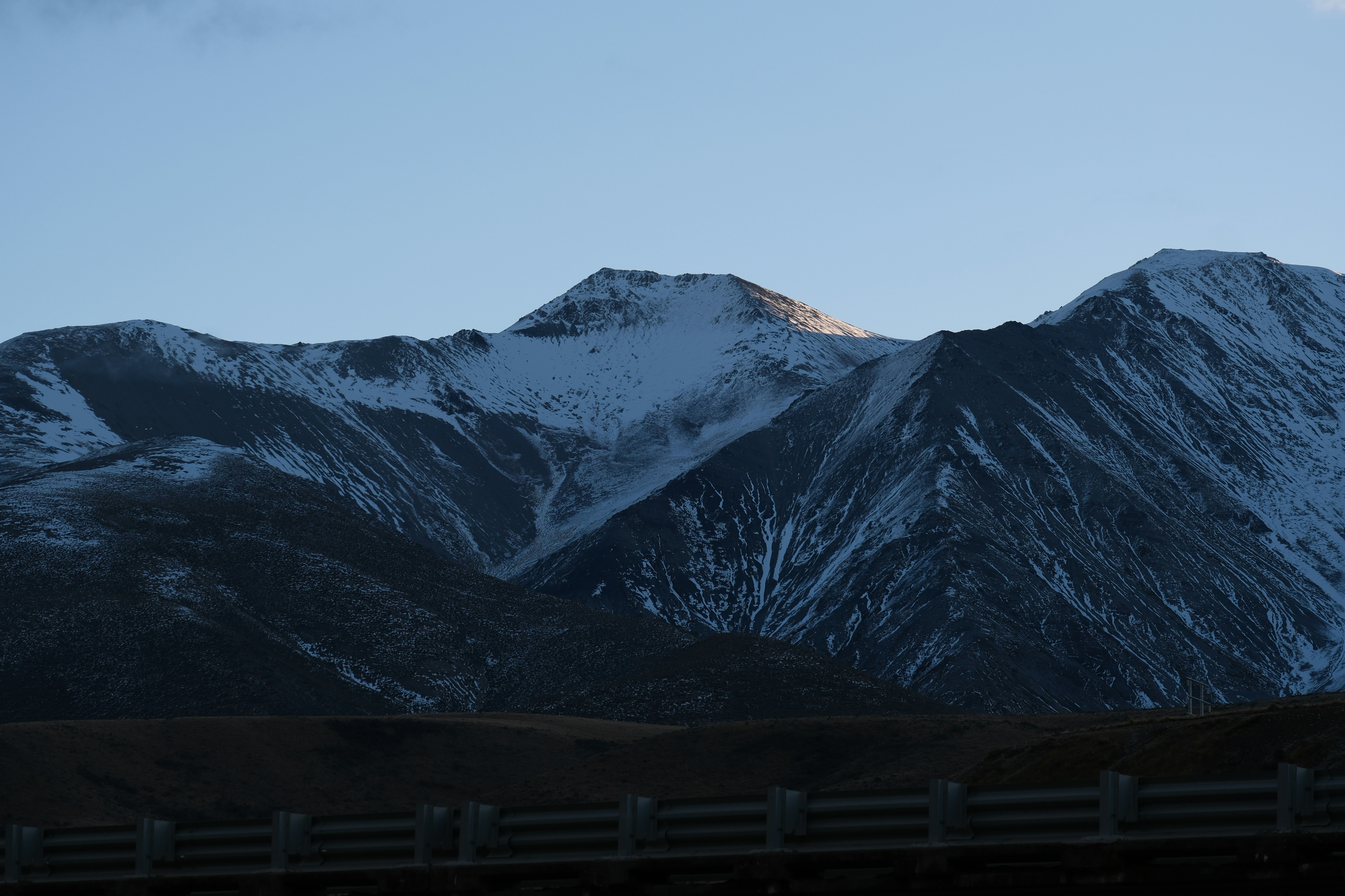 Snowbound Summit: A Quiet Ridge Under a Pale Sky