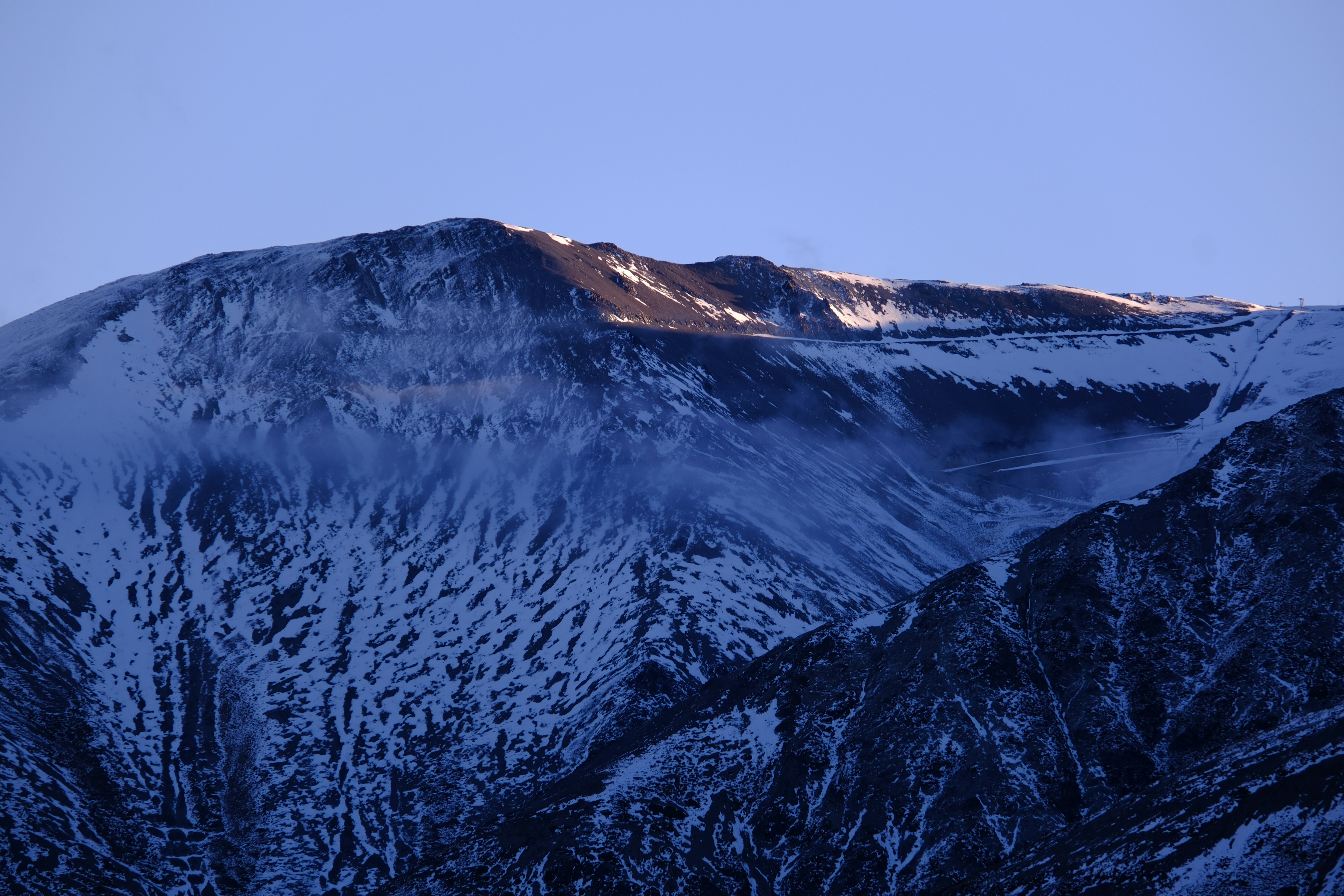 Twilight Crest: Snow-kissed Ridge at First Light