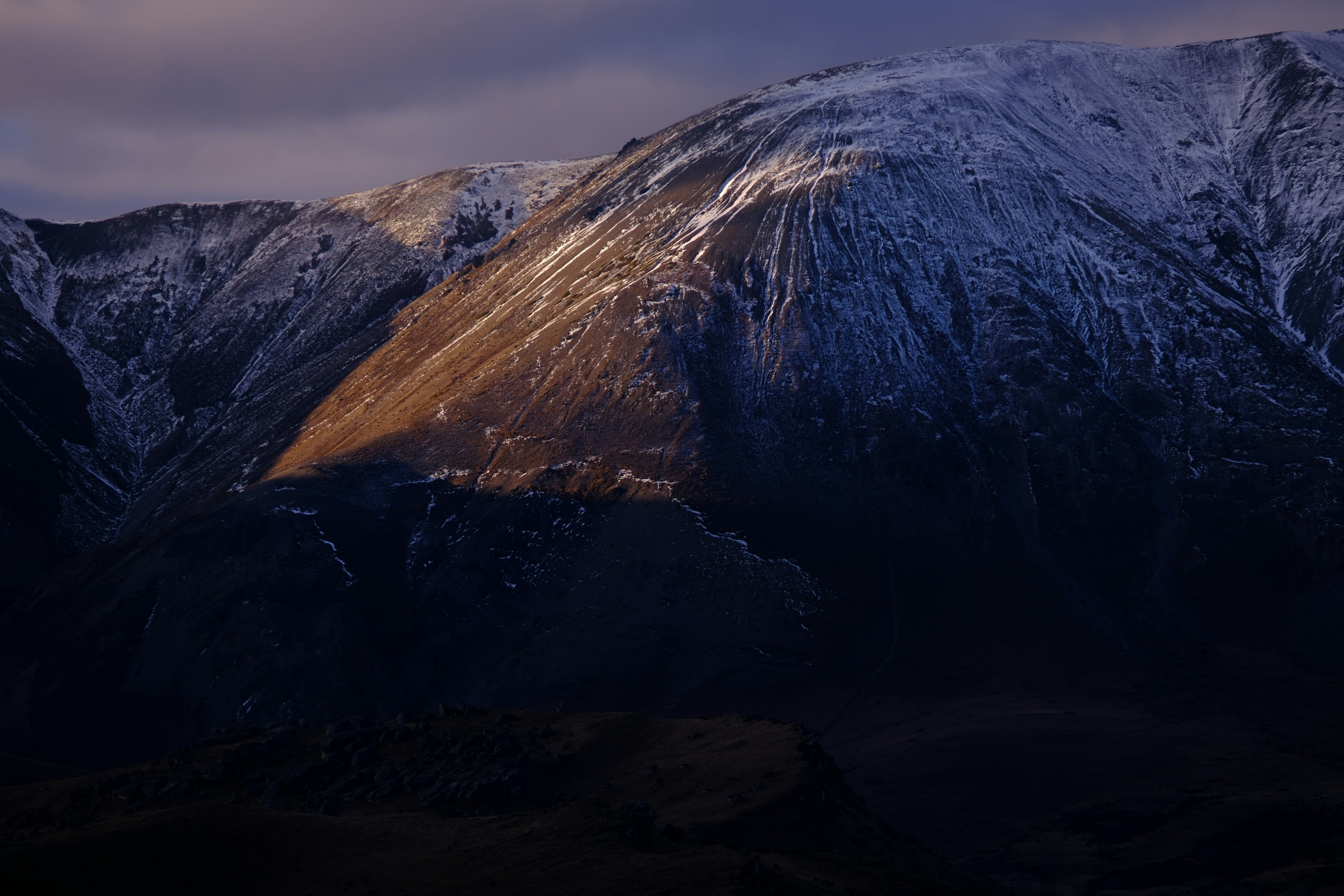 Dawn's Edge: Snow-kissed Ridge Cast in Warm Light