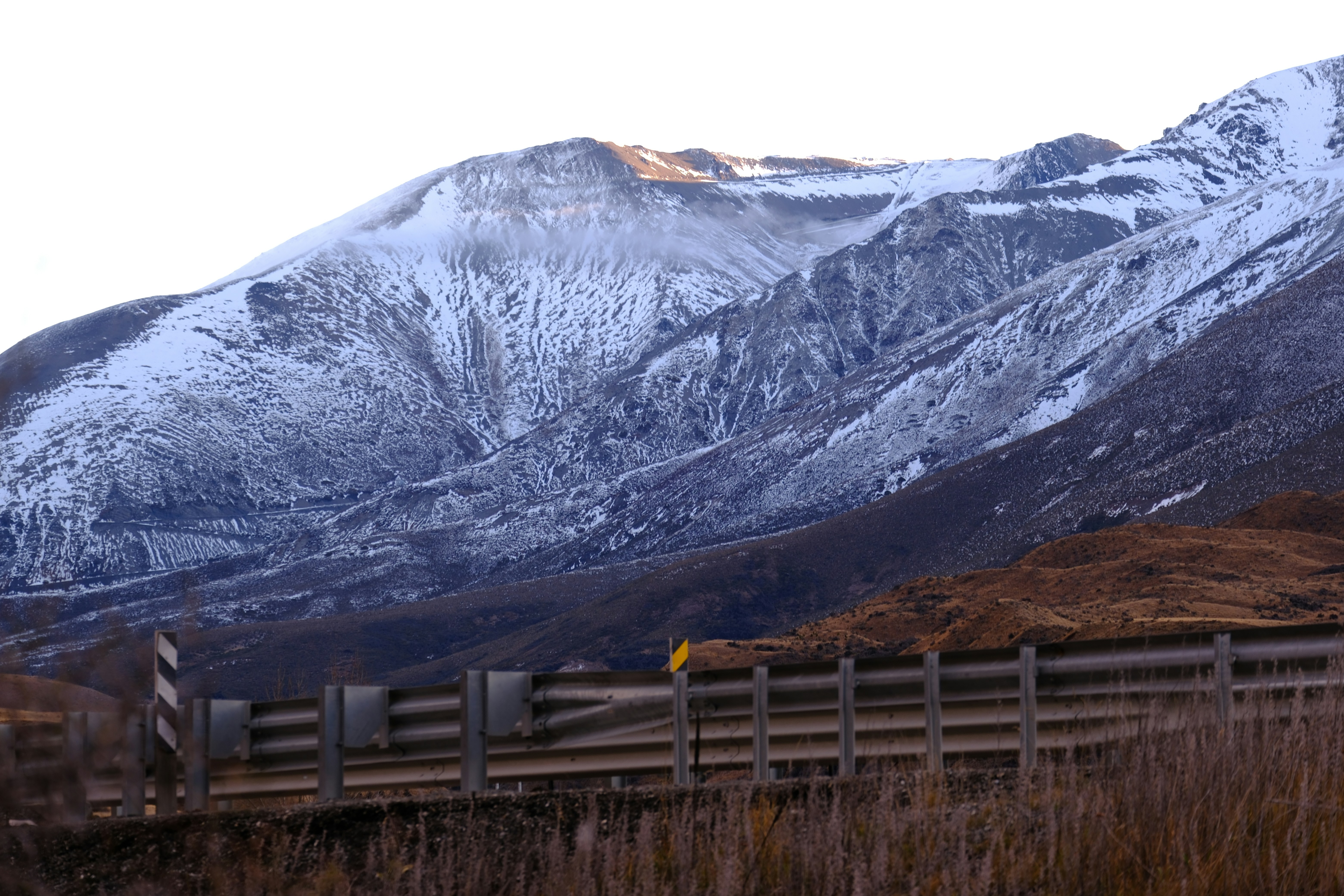 Snow-kissed Ridge Under a Quiet Sky
