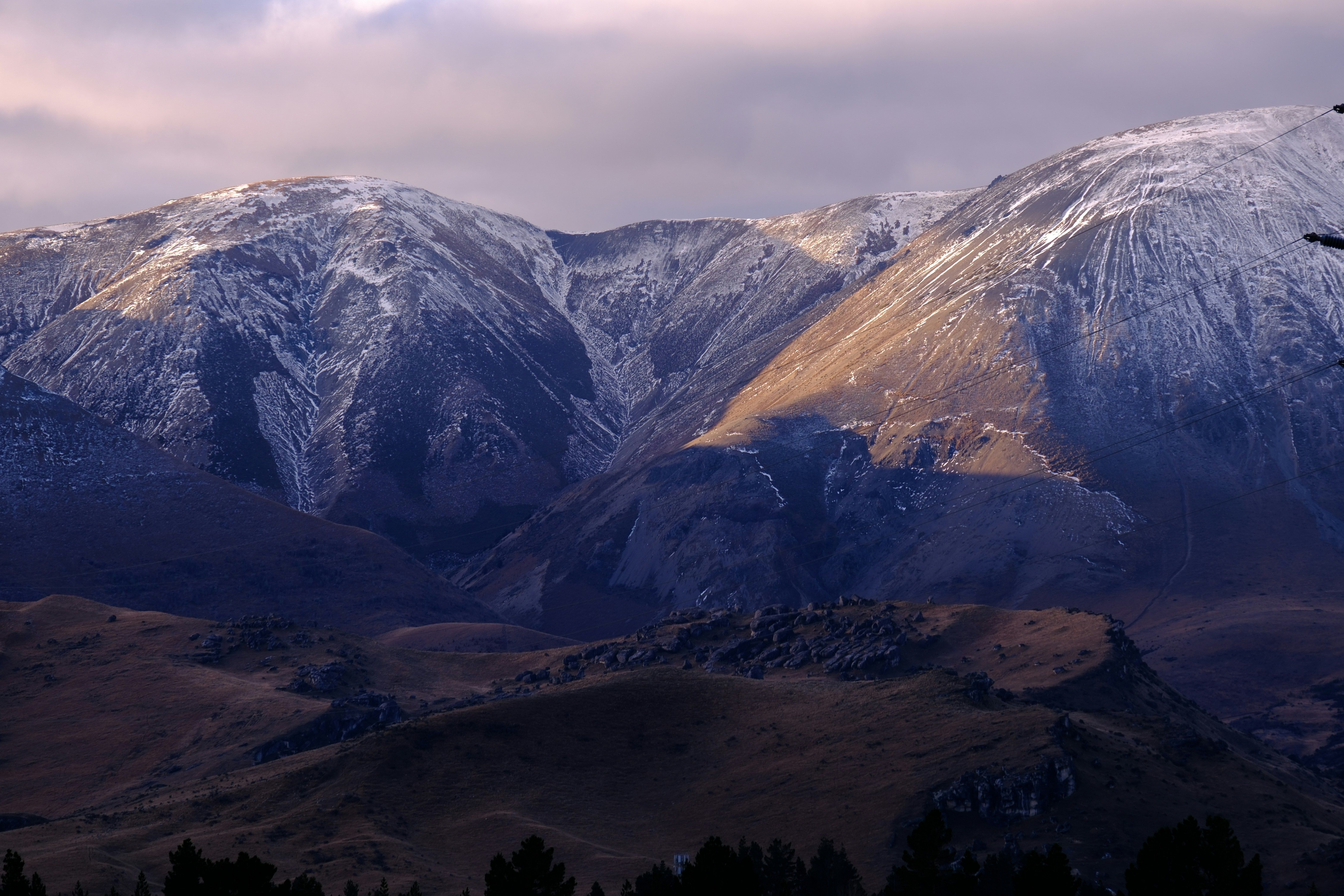 Snow-kissed Peaks Catch the Last Light