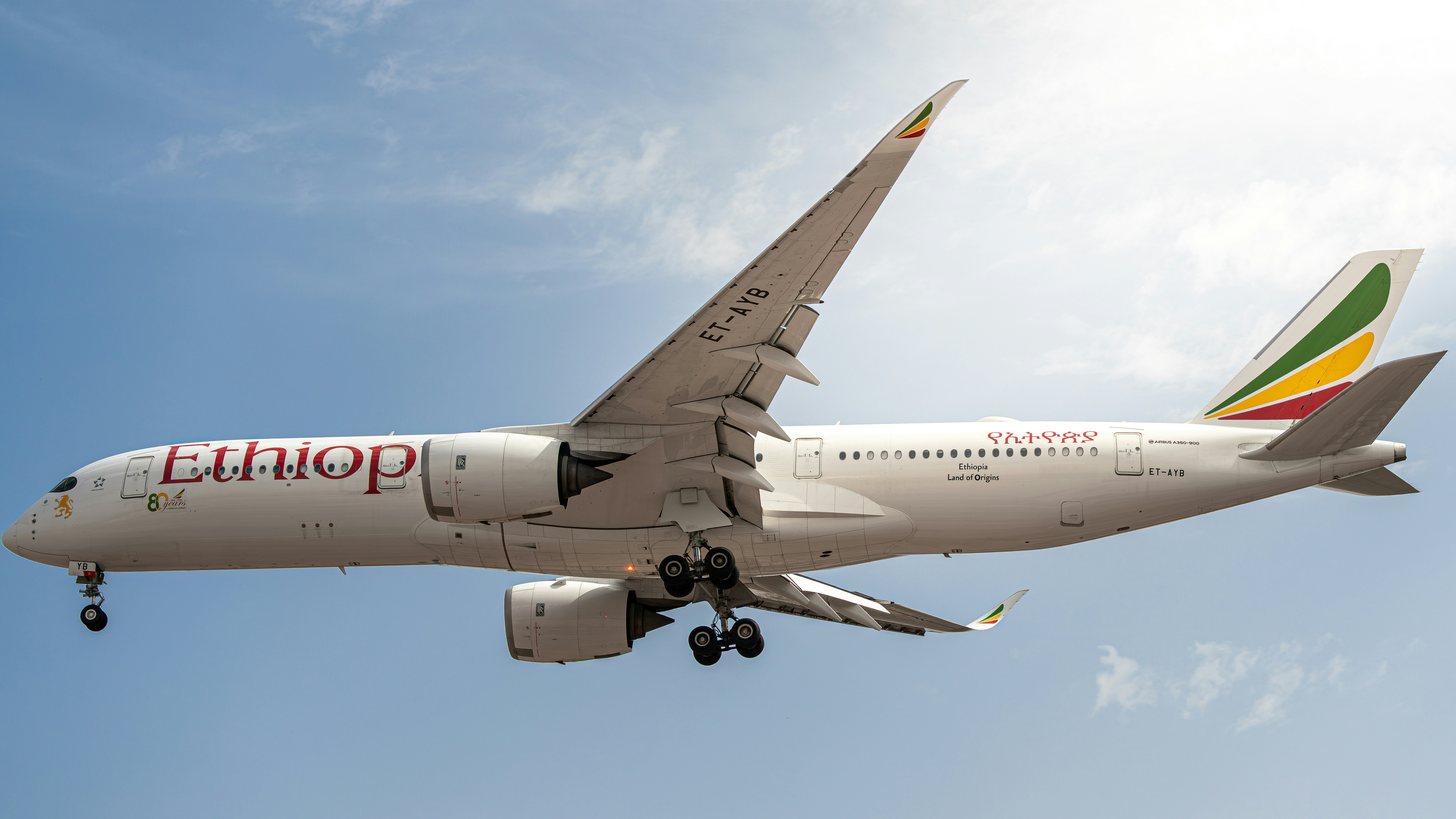 Approaching Sunrise over a Ethiopian Airlines A350 in ascent