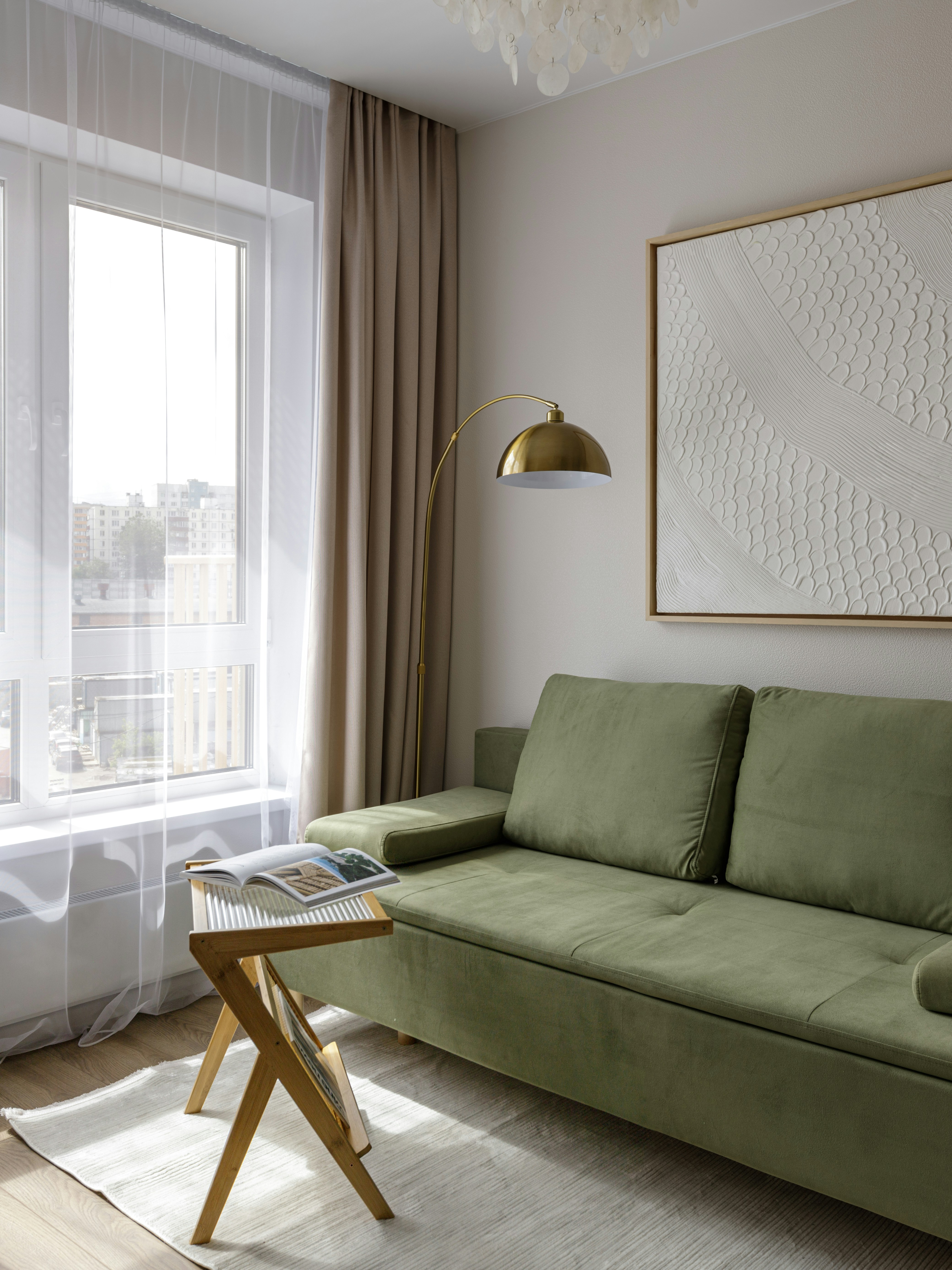 Soft Morning Light on a Green Sofa in a Minimal Living Room