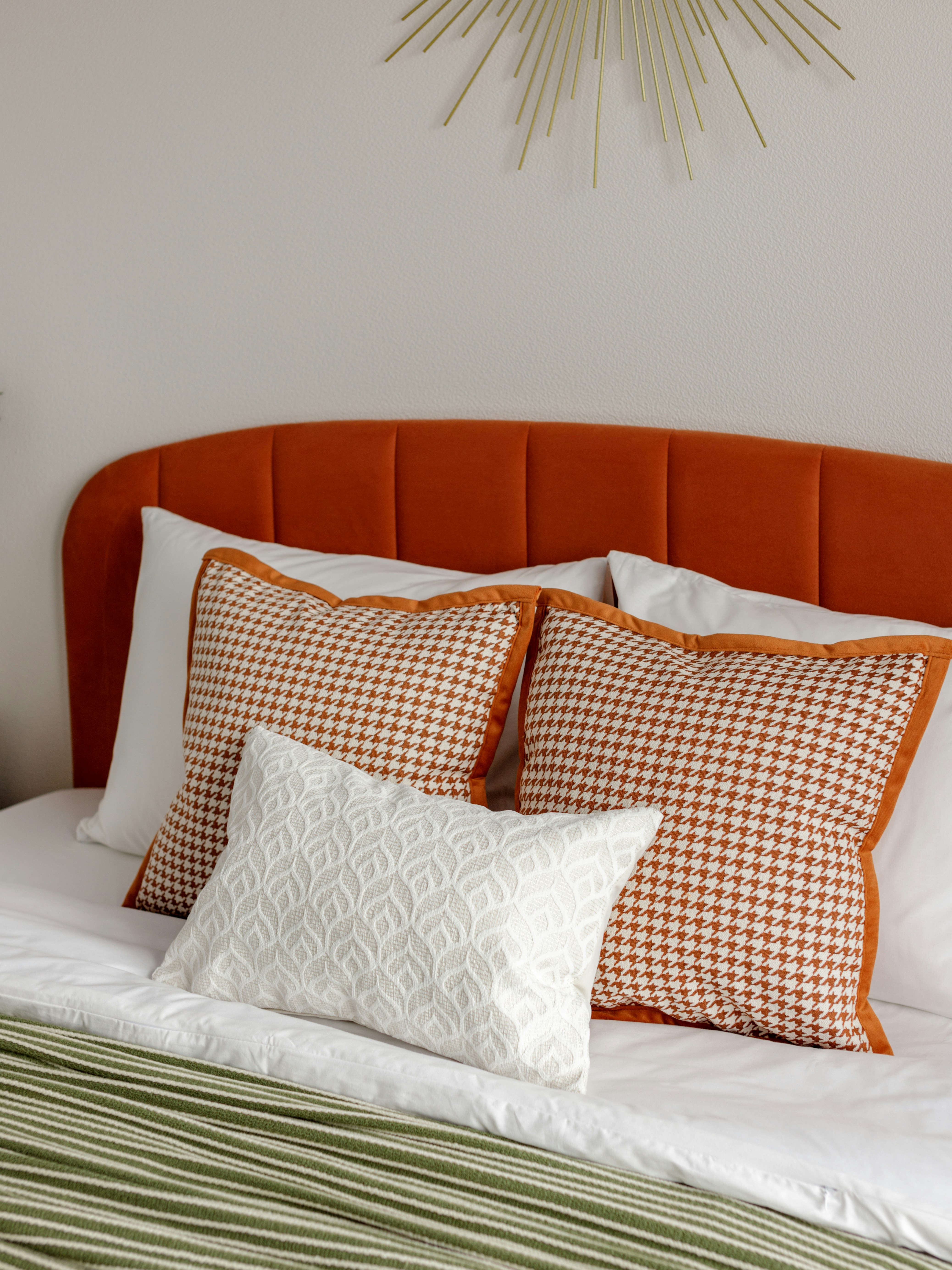 Orange Velvet Headboard with Serene Tossed Cushions
