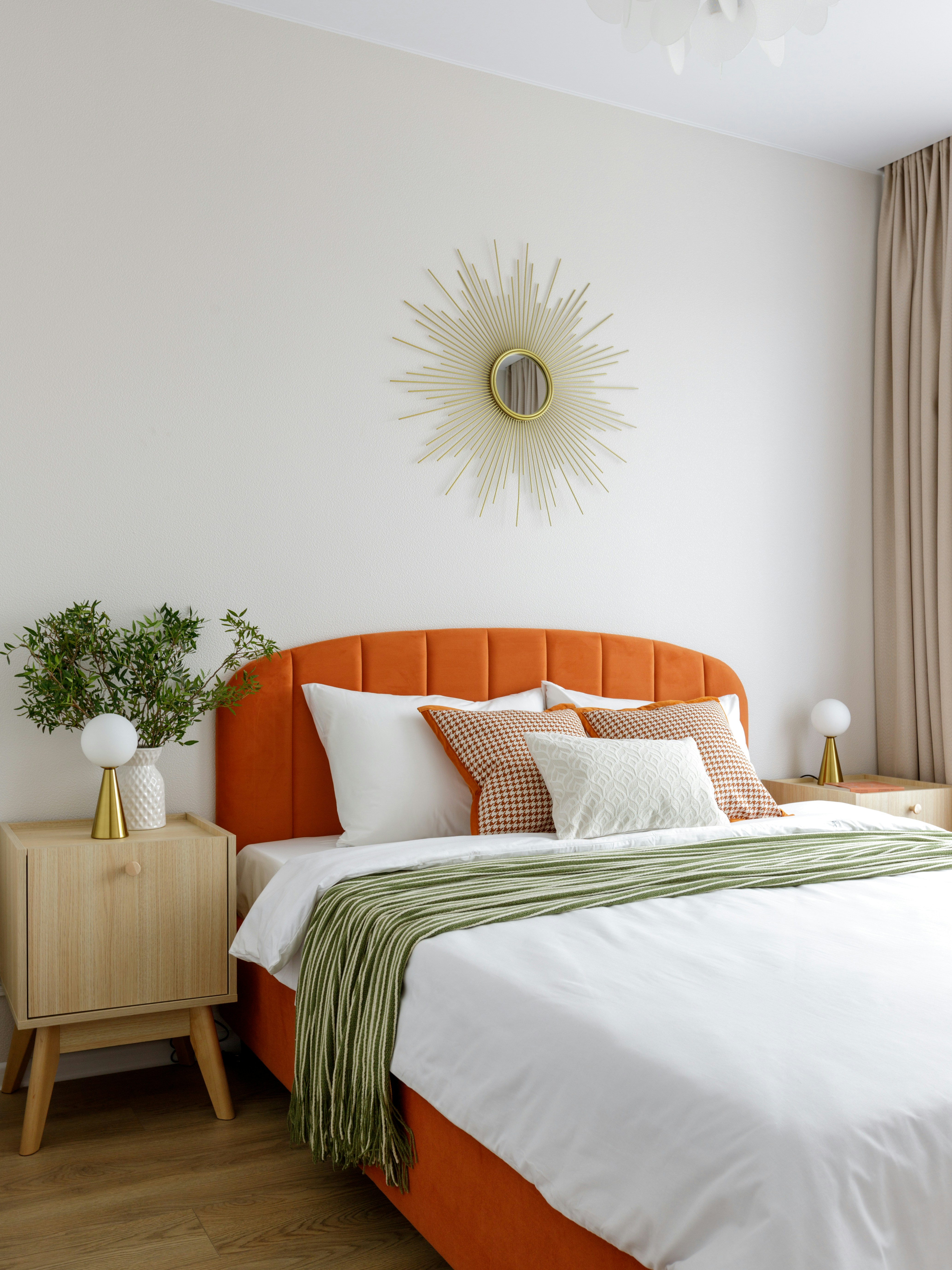 Sunburst Headboard Symphony: An Orange Oasis in Calm Neutrals