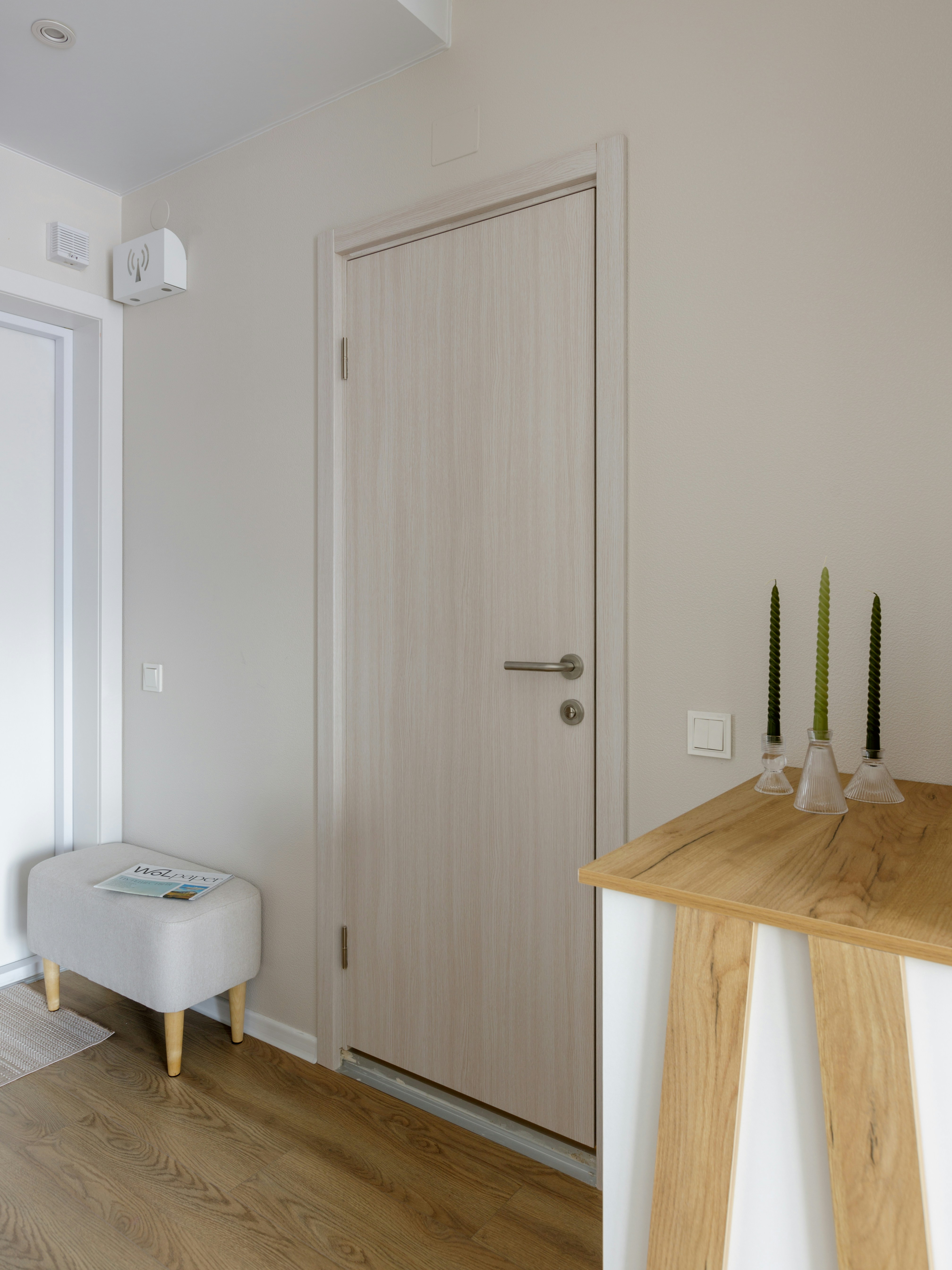 Minimalist Hallway Hallmark: A Quiet Doorway with a Wood-Top Counter