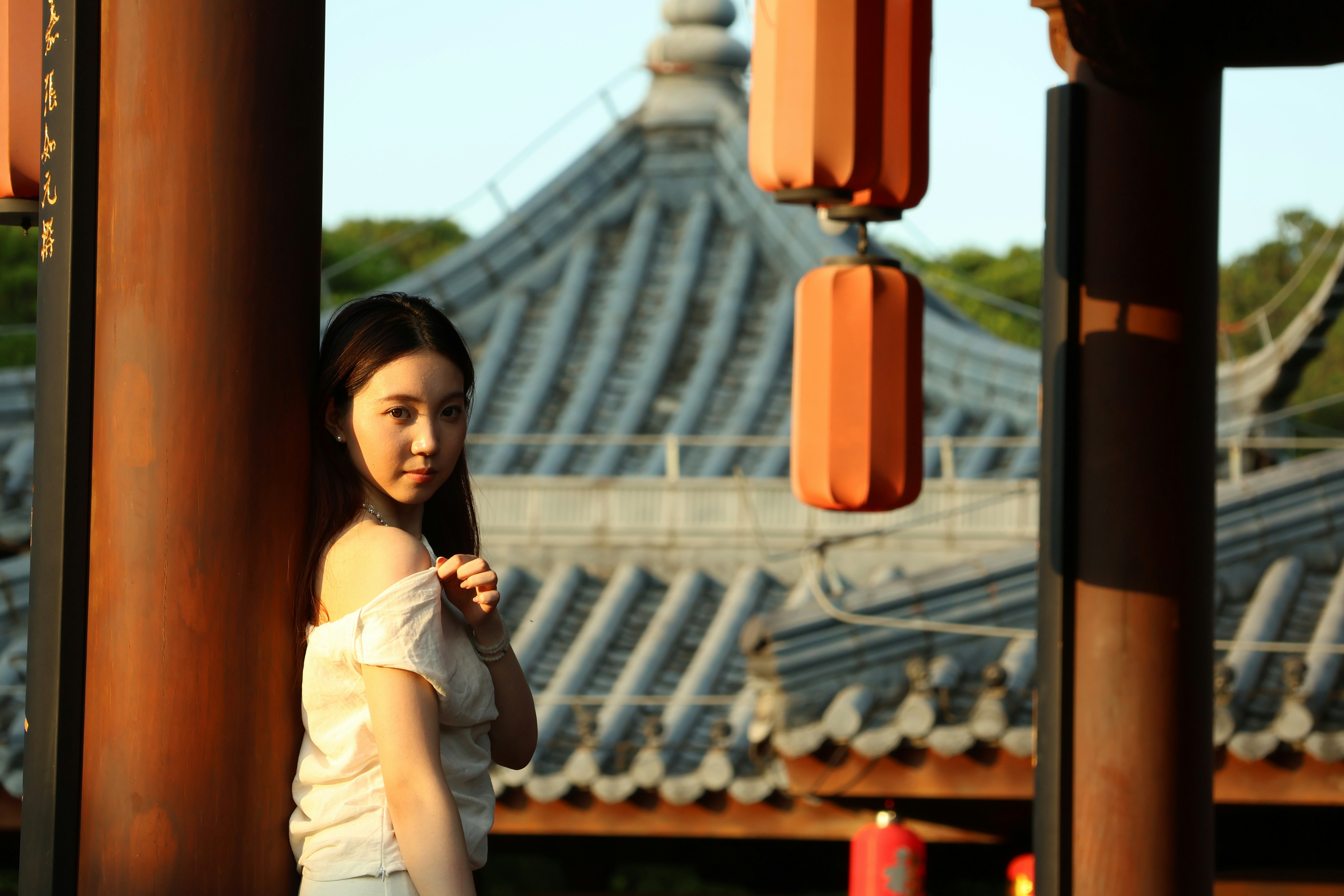 Whispers between Pillars: A Portrait in Lantern Light