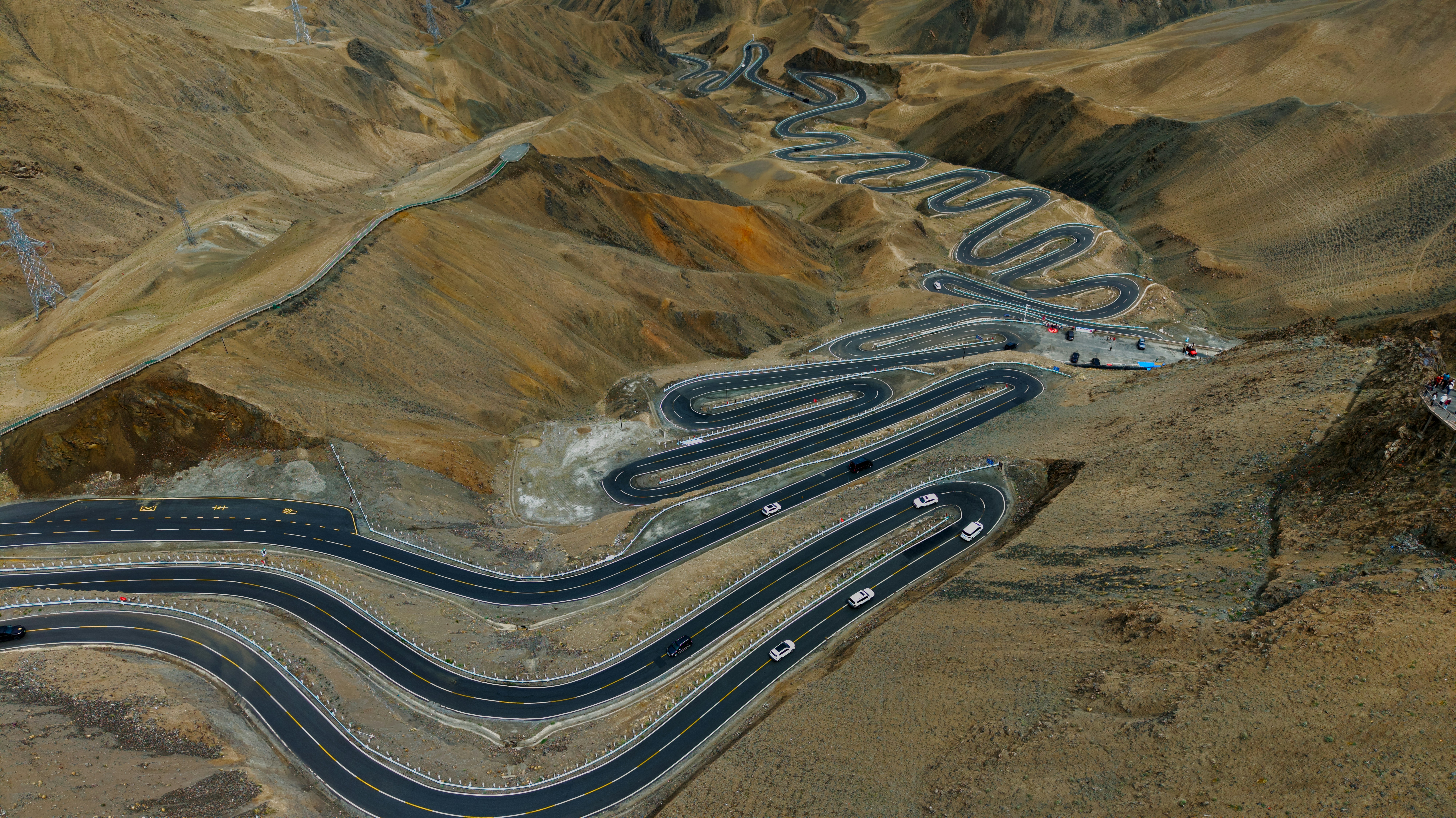 Serpentine Ascent: A Carved Road Winding Through Arid Switchbacks