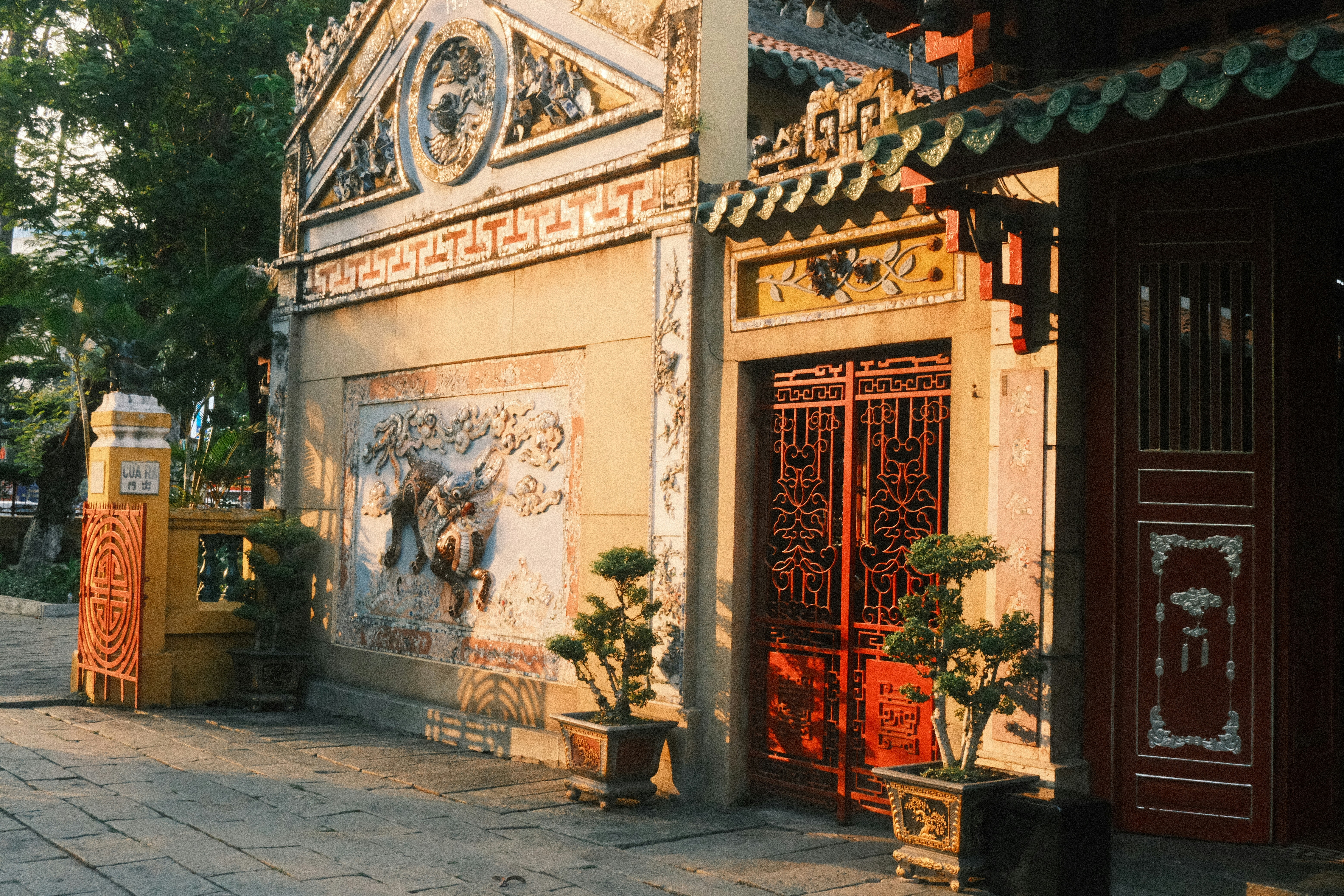 Ceremonial Gate and Ornate Doorway in a Sunlit Courtyard