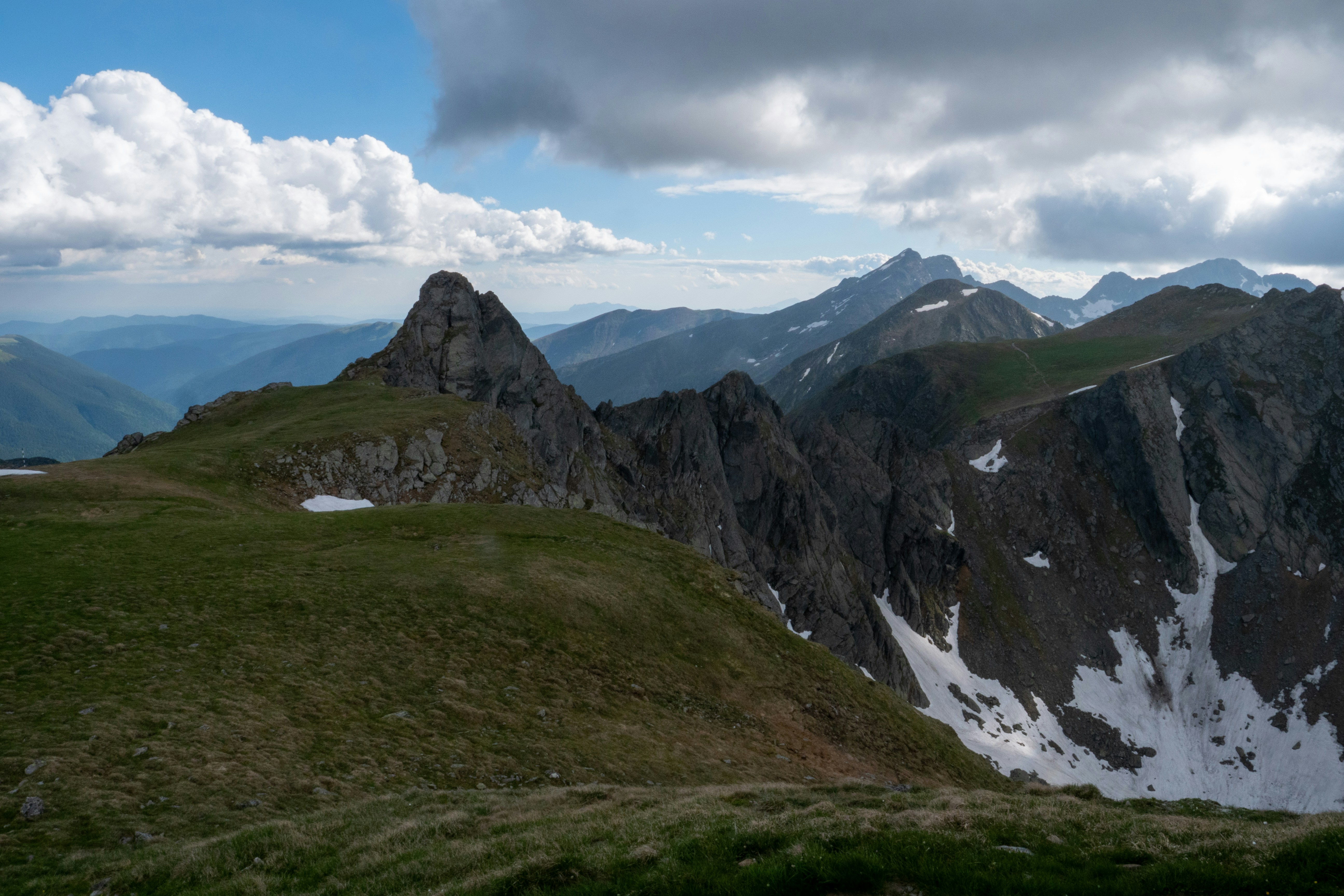 Ridge Crest at Distant Peak: A Moment Between Storm and Sky