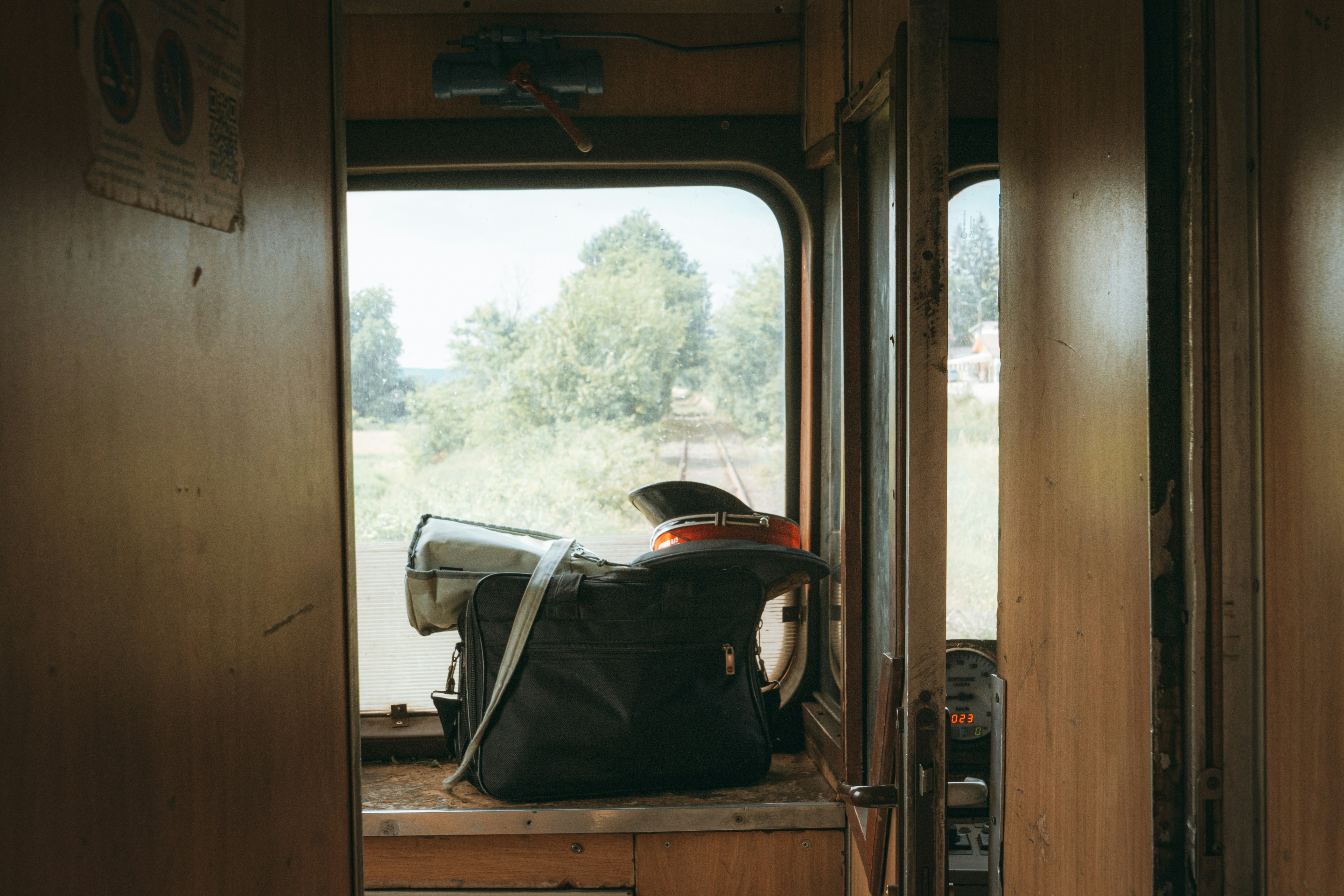 Quiet Cab Corner: A Backpack Resting by the Window Frame