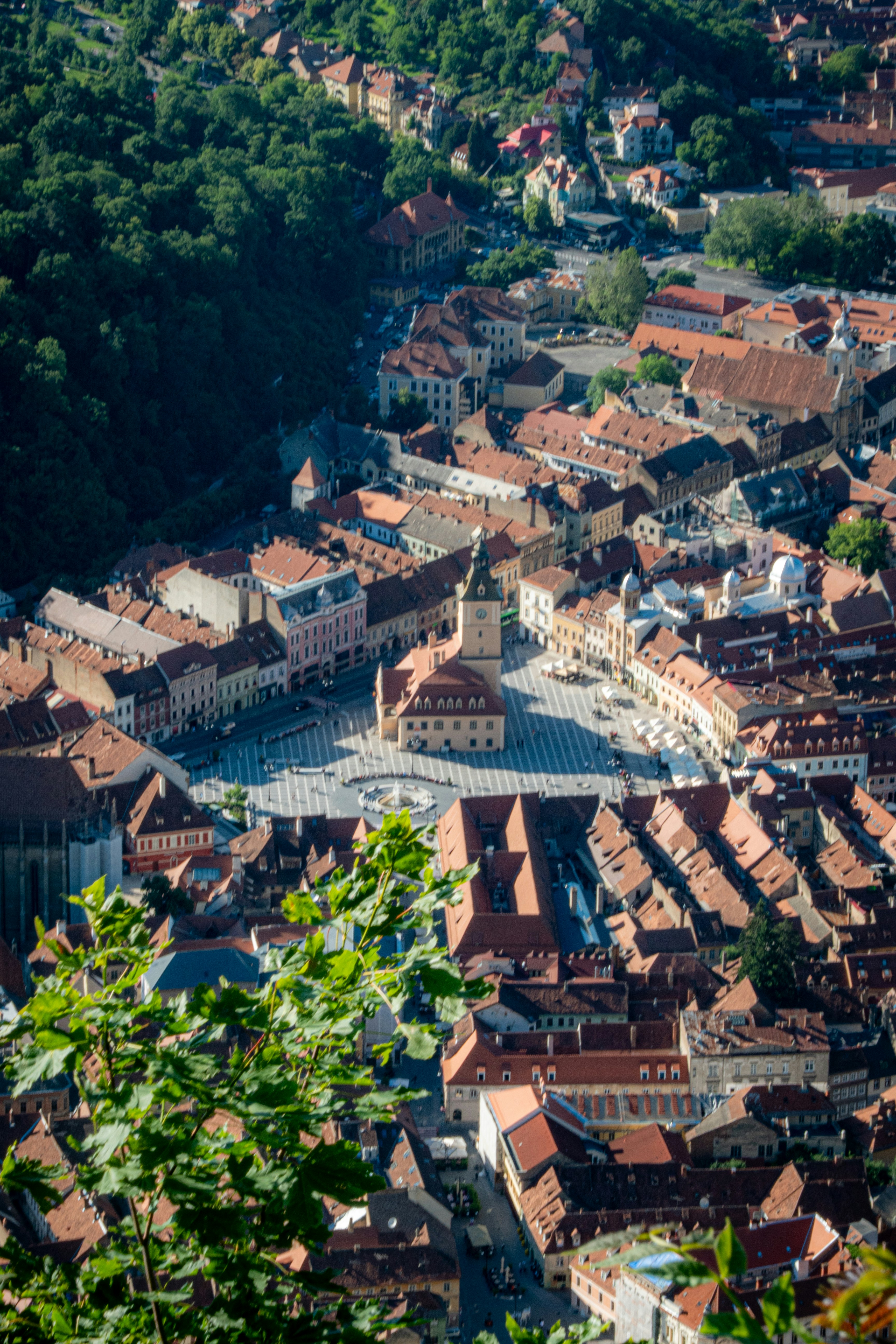 Aerial Tapestry: A hillside town unfurls from the church square
