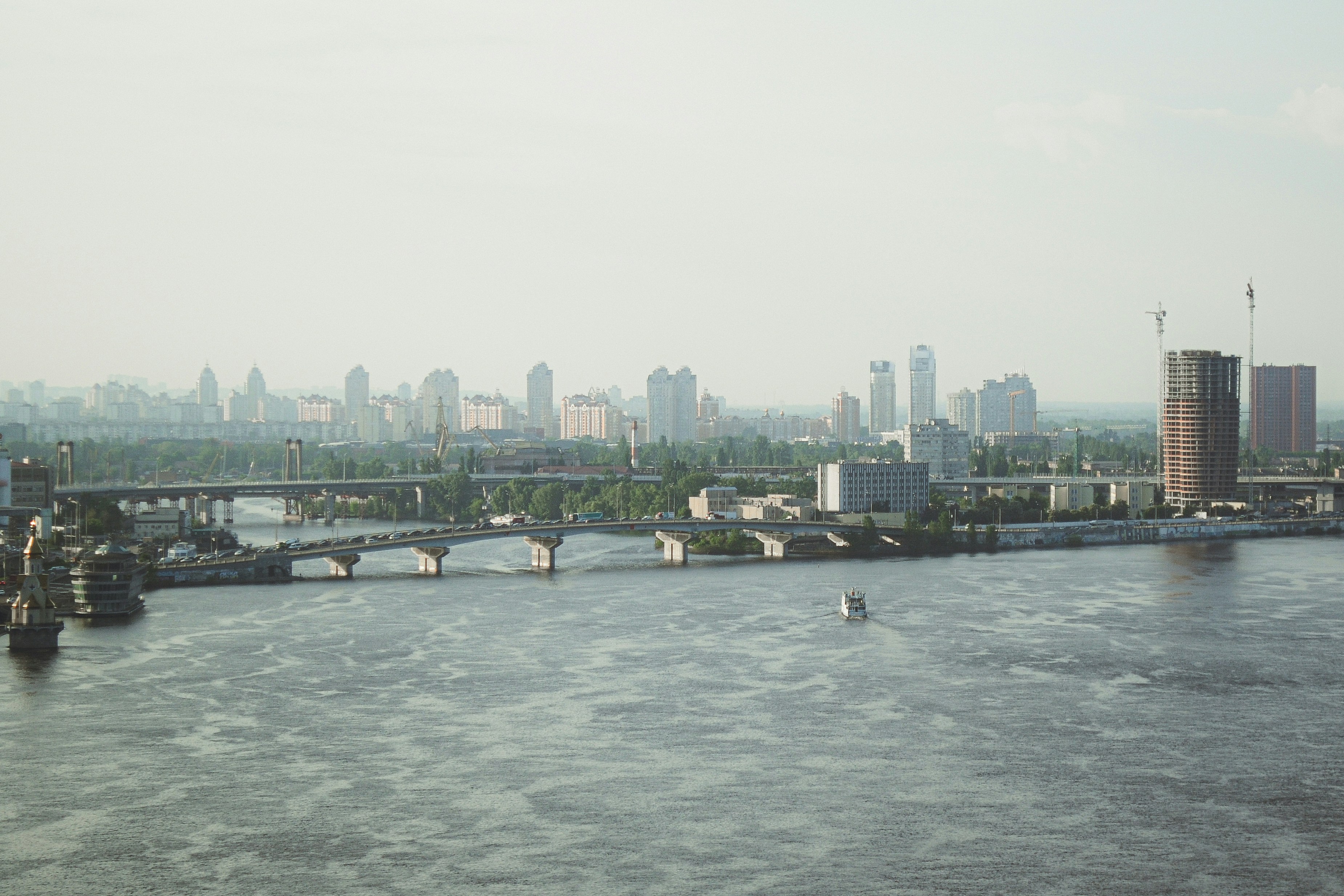 Bridge Horizon: City Skyline Over Still Water