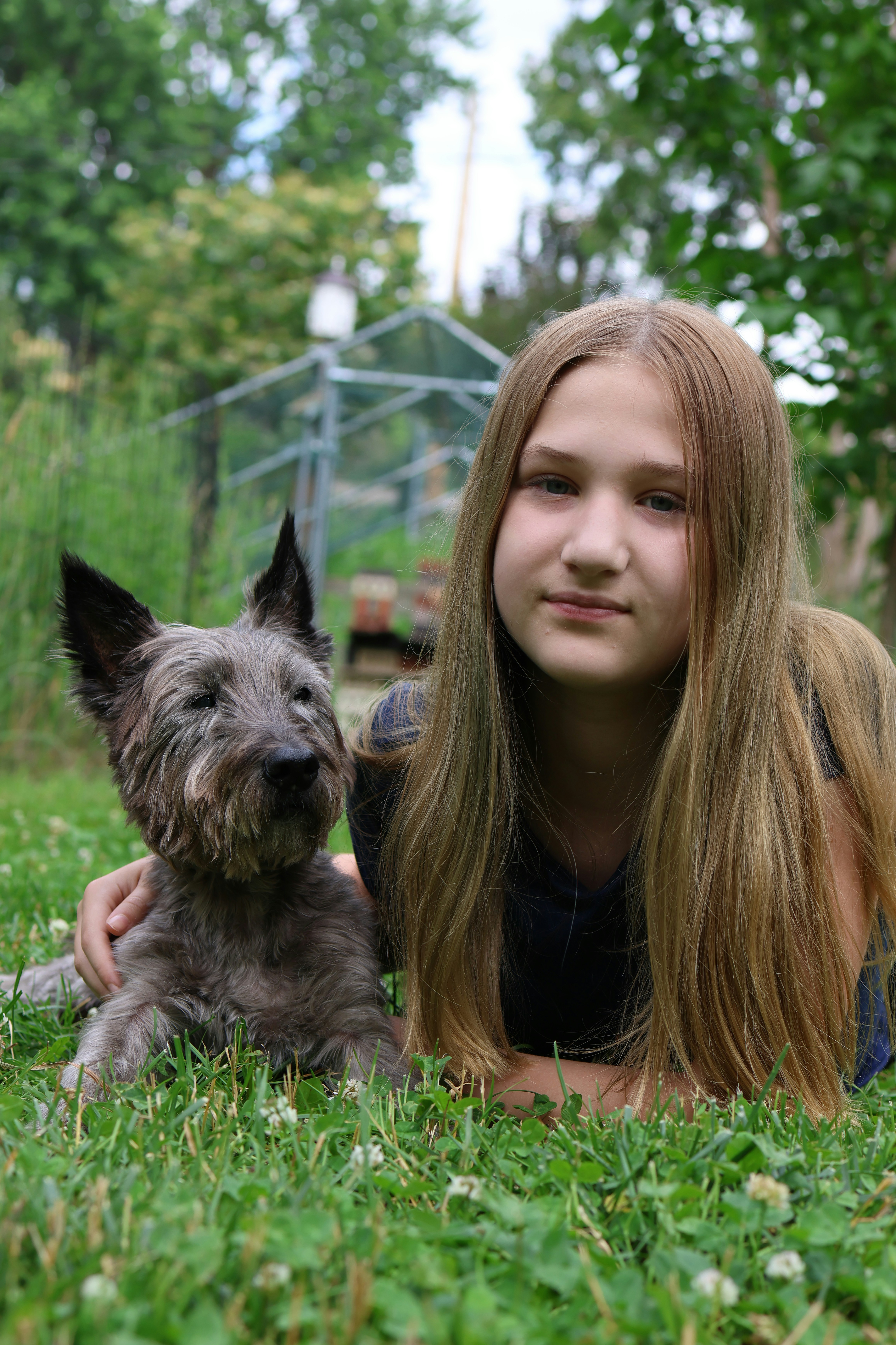 Laughter in Green: A Girl and Her Scruffy Companion