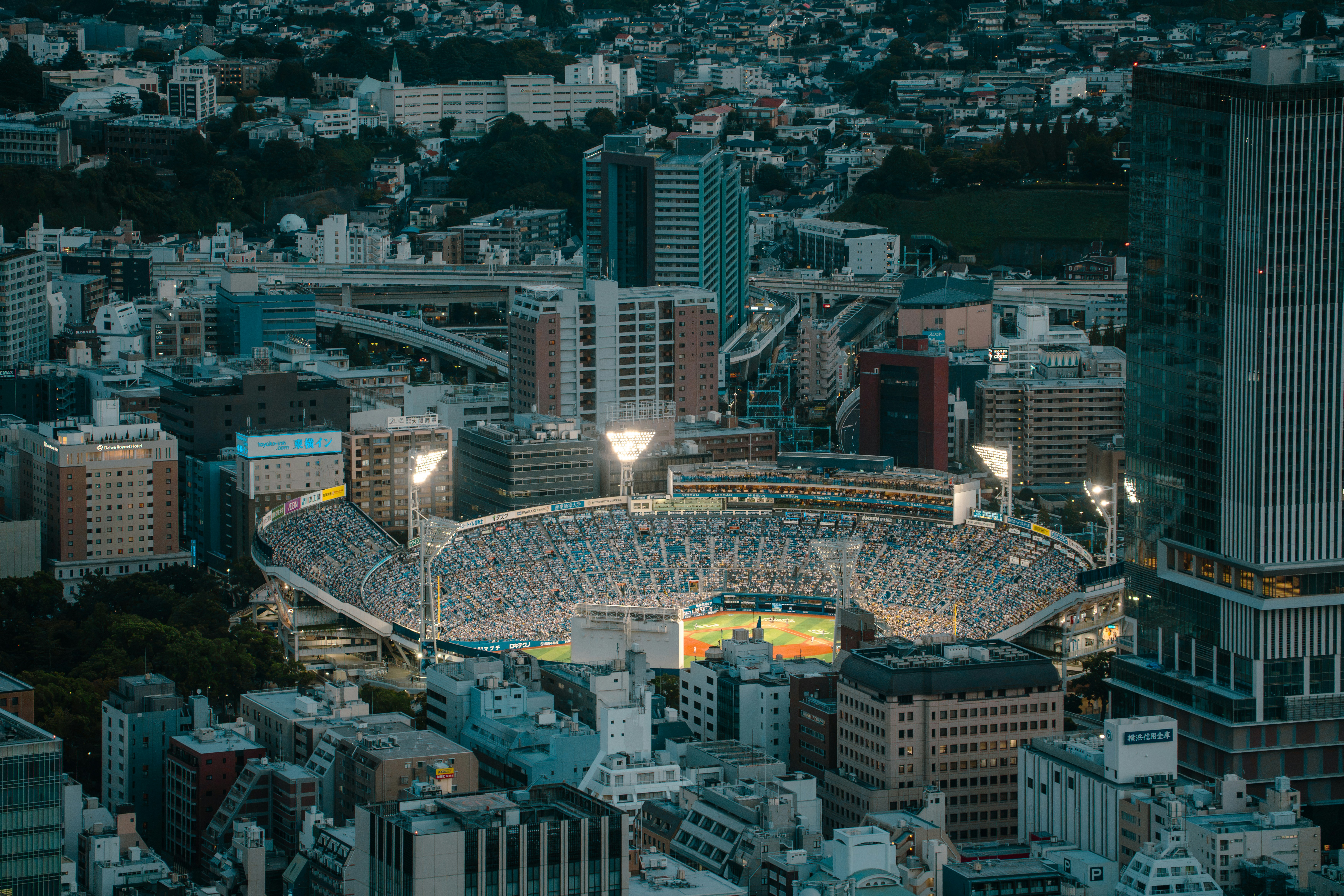 City in Bloom: A Baseball Stadium Nestled Among High-Rises at Dusk