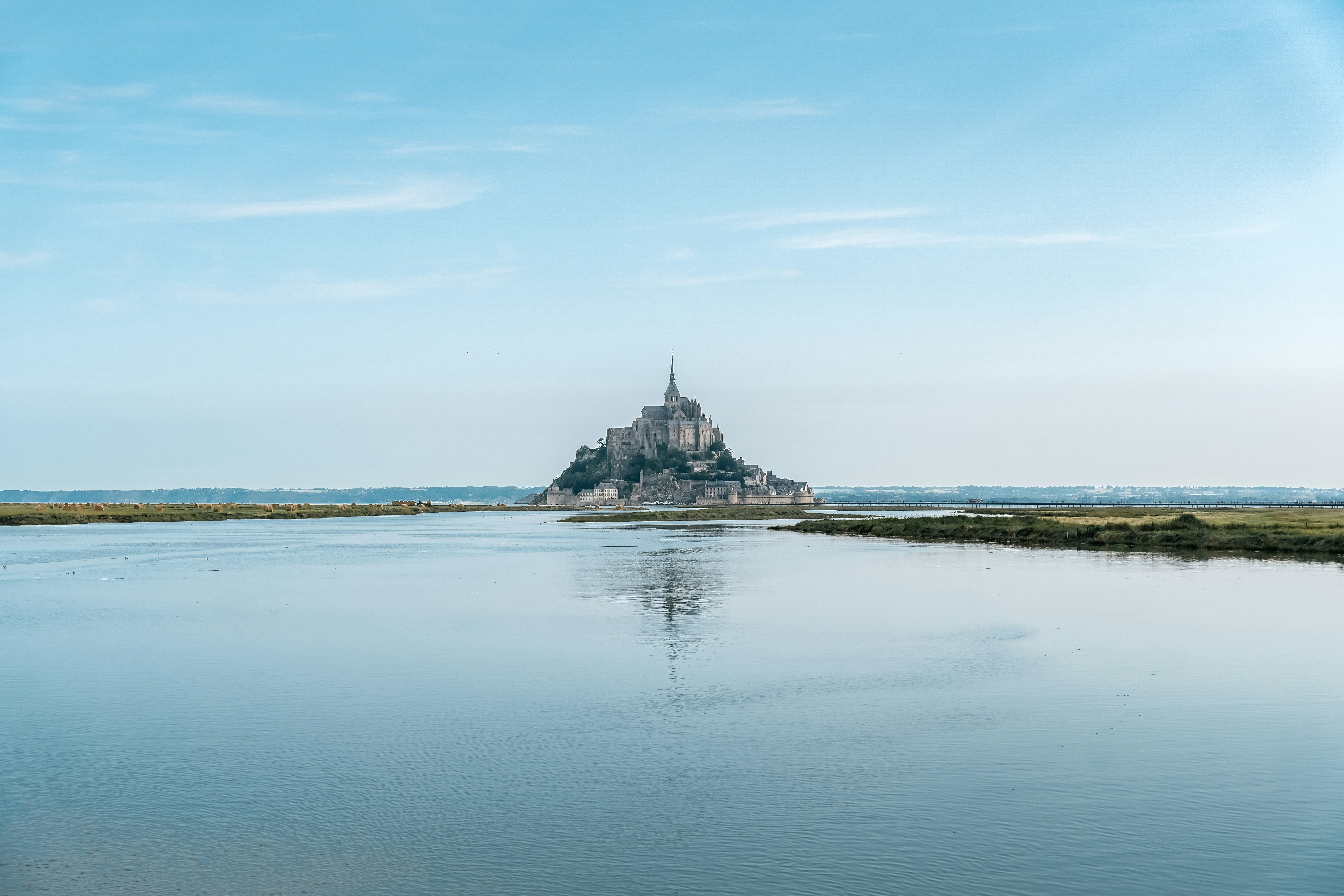 Isolated Abbey Rising from Tidal Mirror
