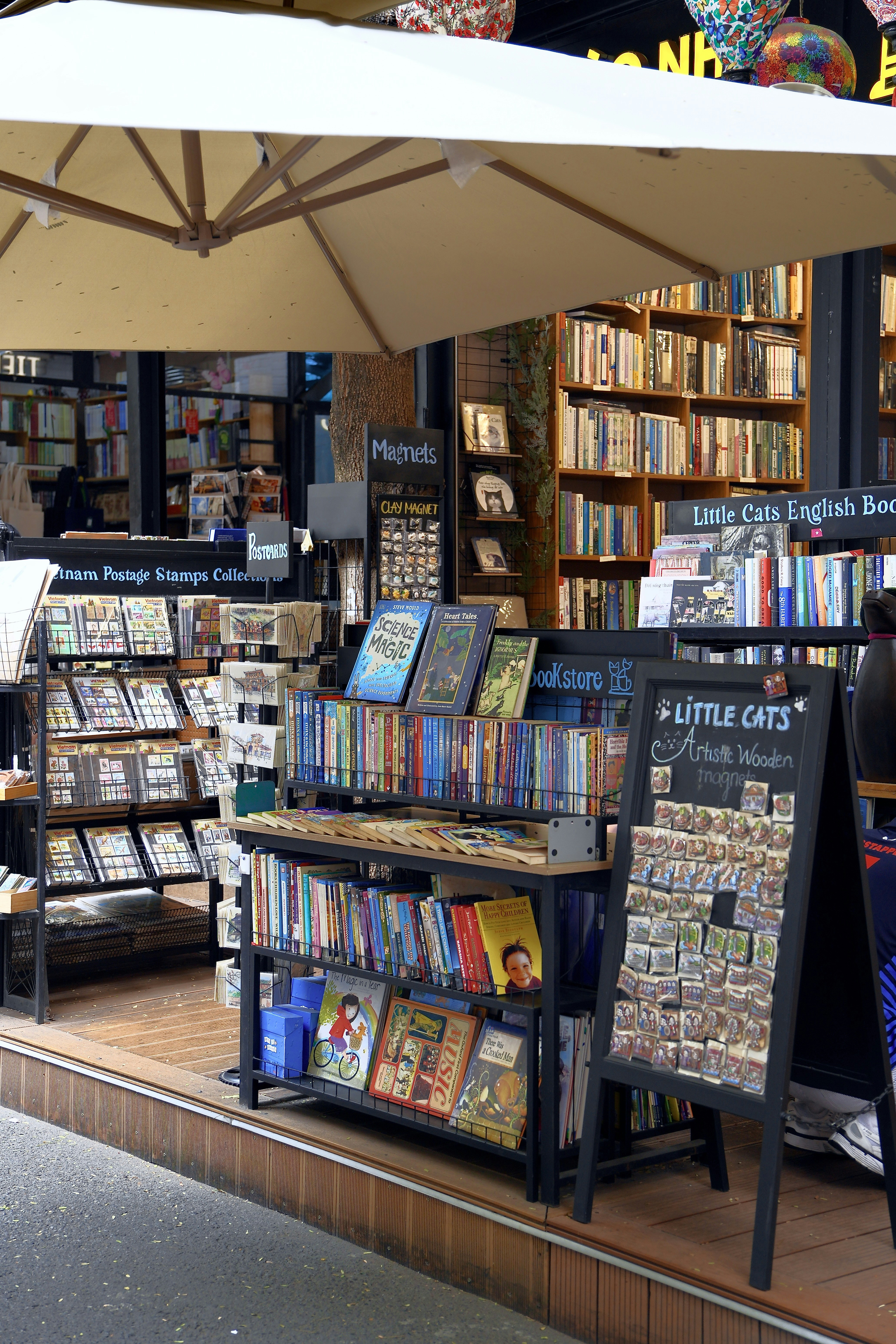 Shopfront Shelves Under a Wide Awning: A Quiet Bookstall Scene