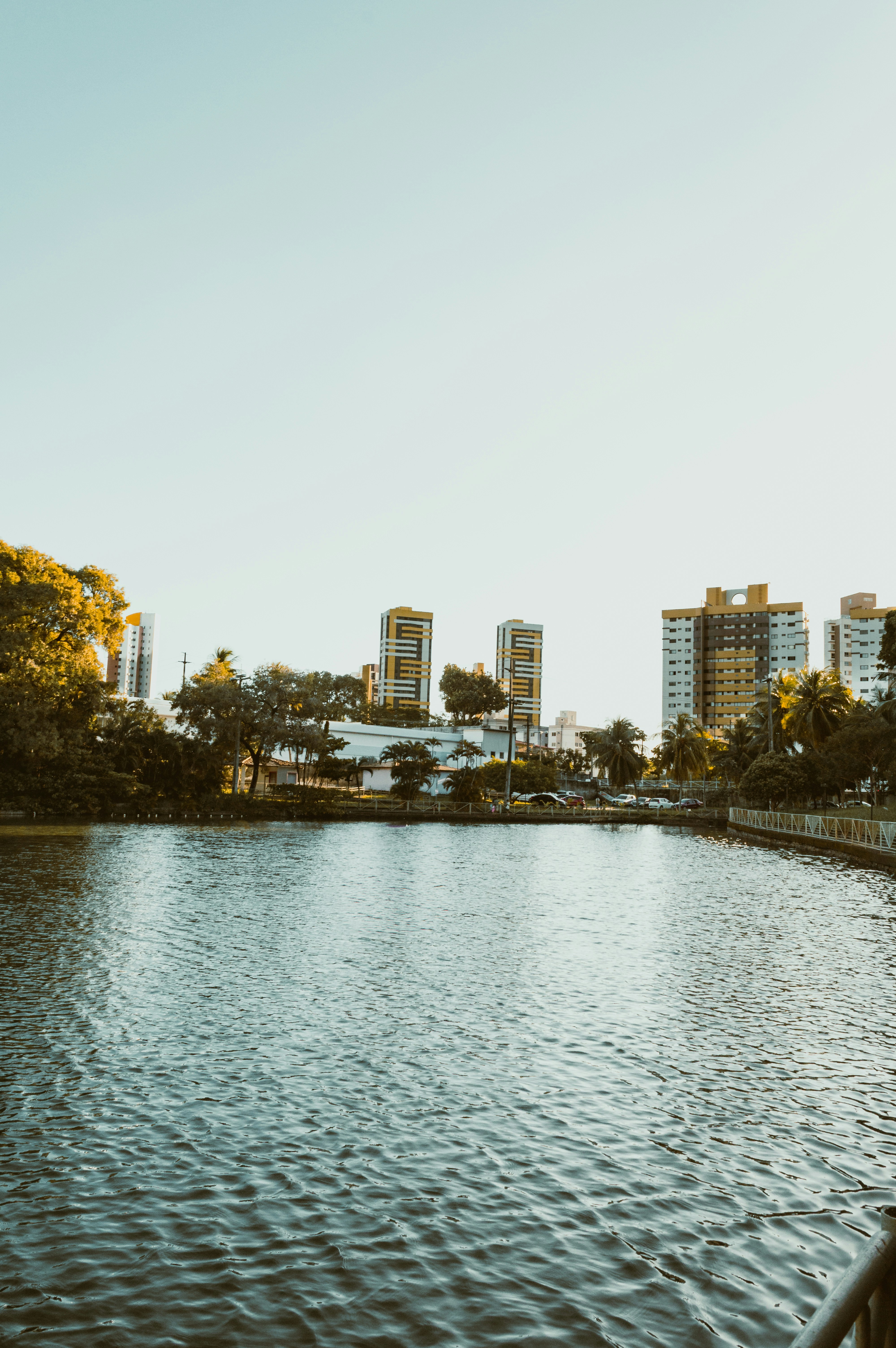 City Edge Reflections: Riverside Skyline at Dusk