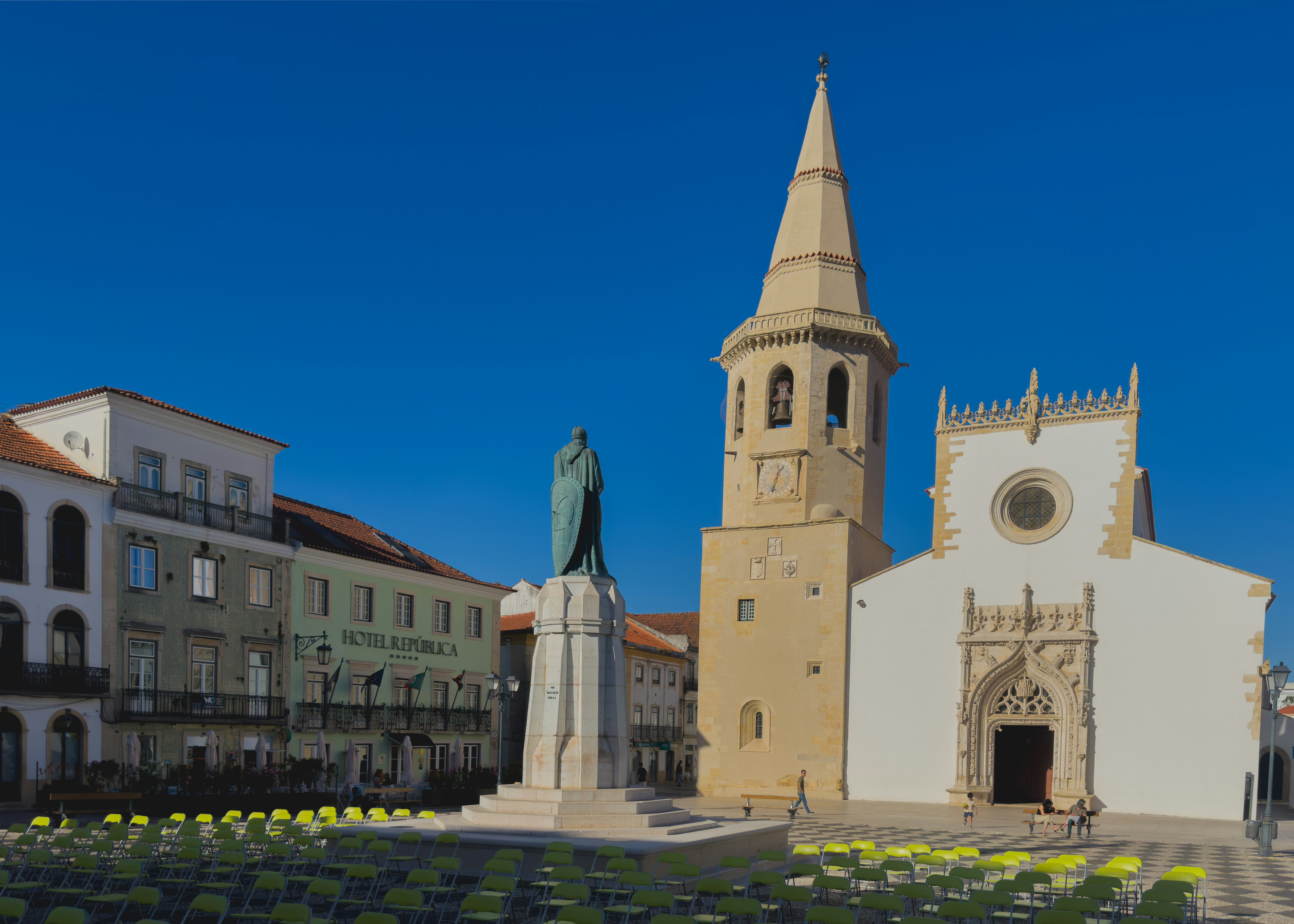 Stone Church and Clocktower Overlooking a Quiet Town Square