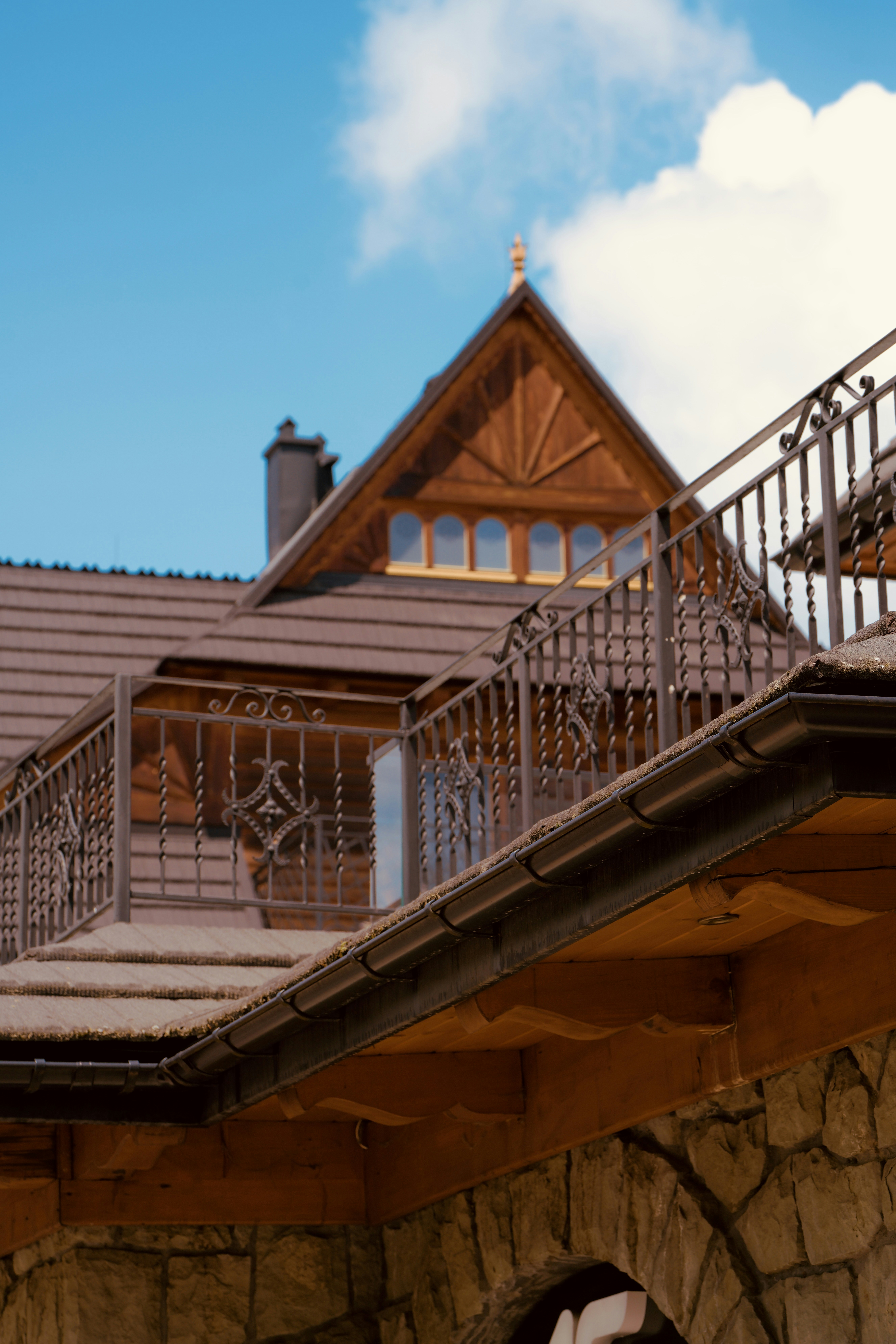 Ornate Balcony Tapestry: A Wooden Villa Overlook
