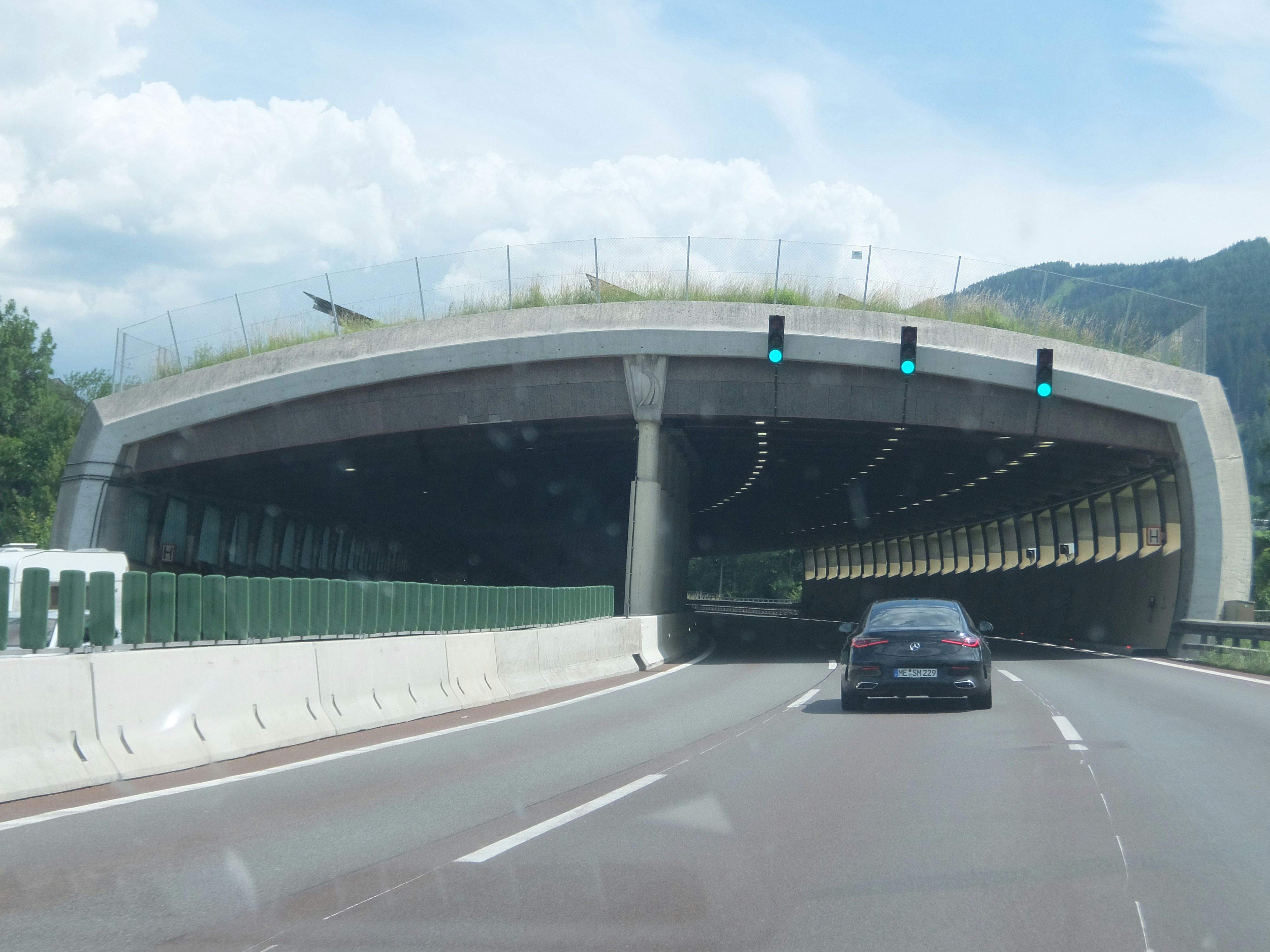 Approaching the Light: A Tunnel Drive Beneath a Quiet Sky