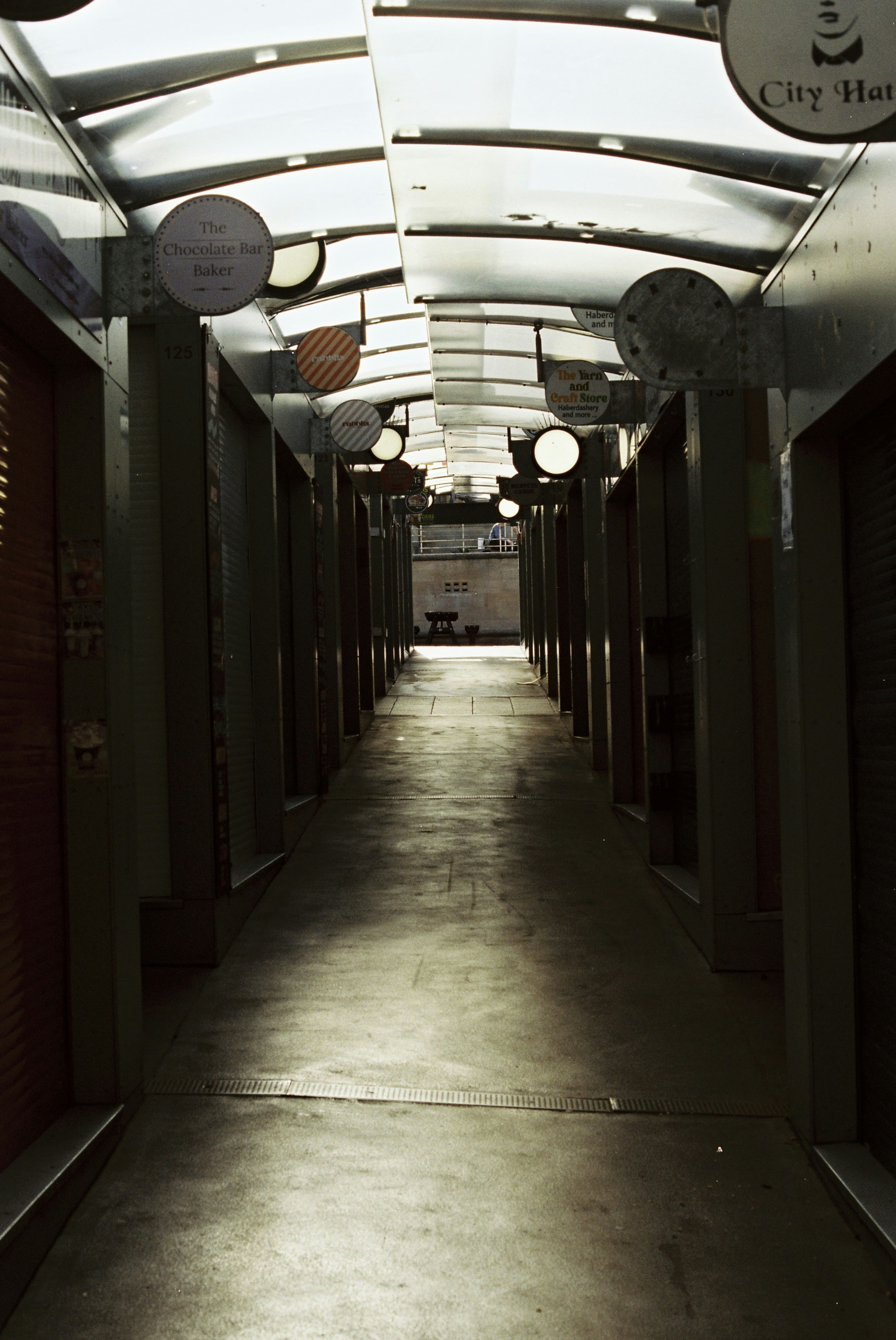 Echoes of Quiet Passage: A Narrow Market Corridor