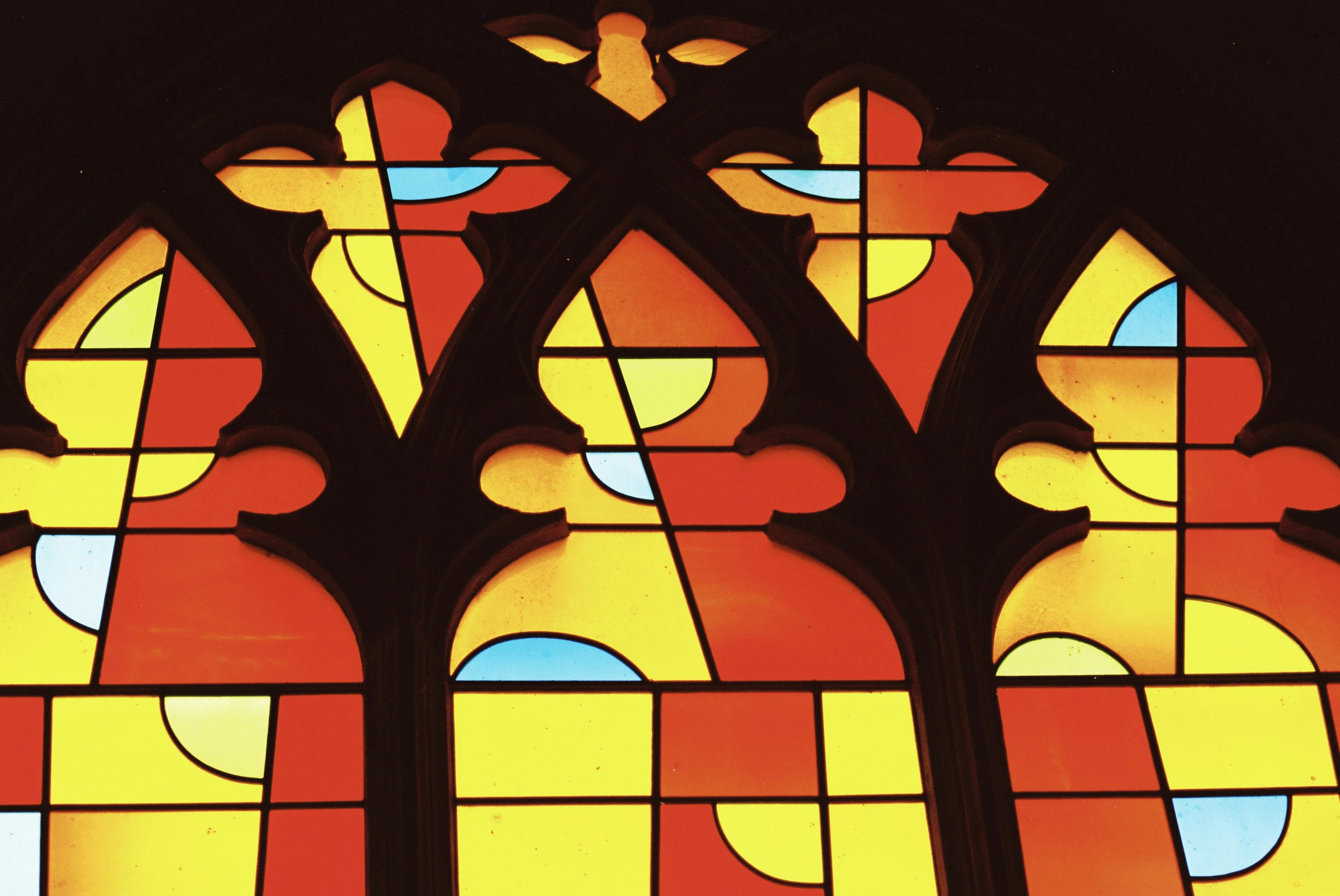 Radiant Geometry: Stained Glass in Warm Ember Hues