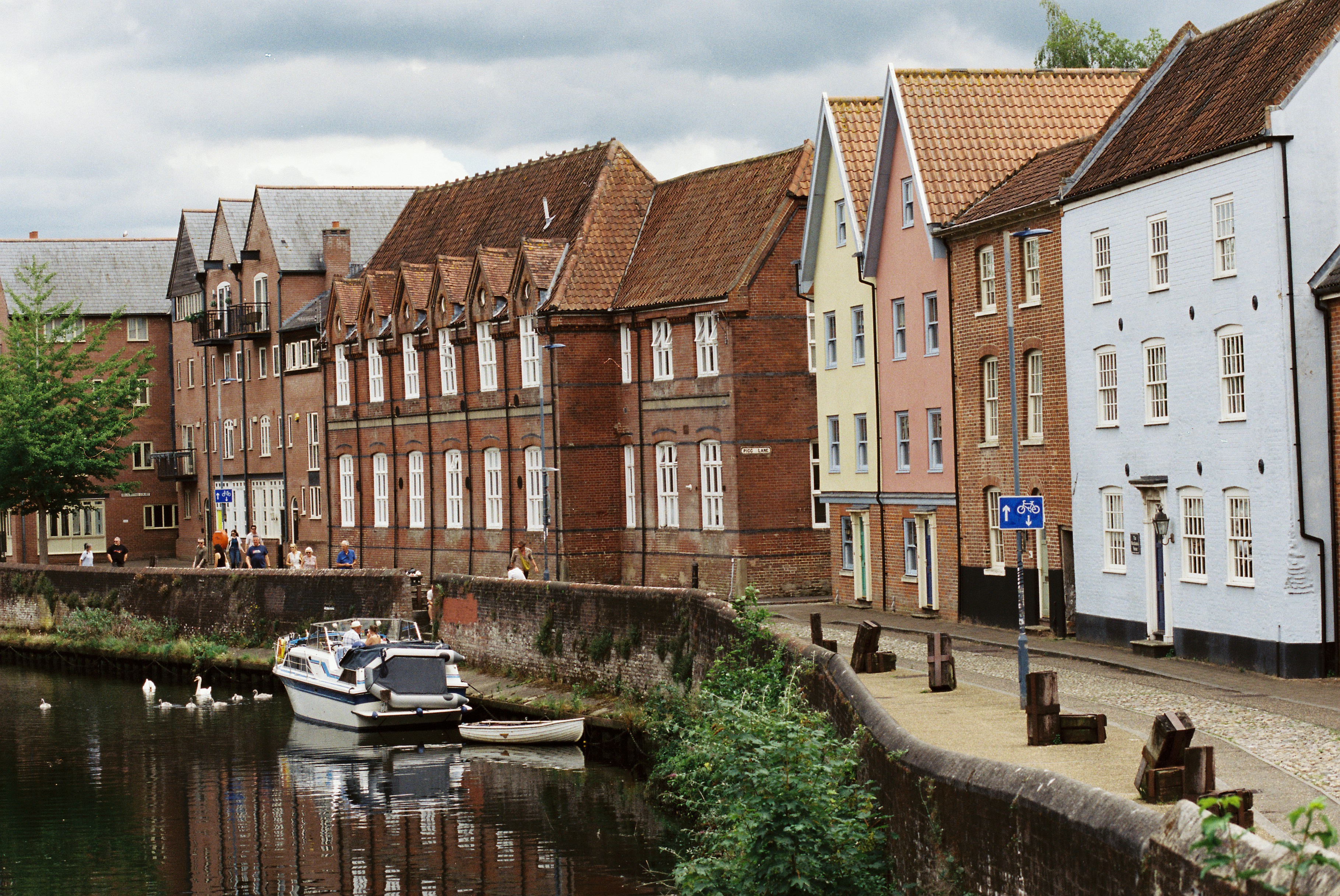 Colorful riverside row: a quiet canal beside pastel townhouses
