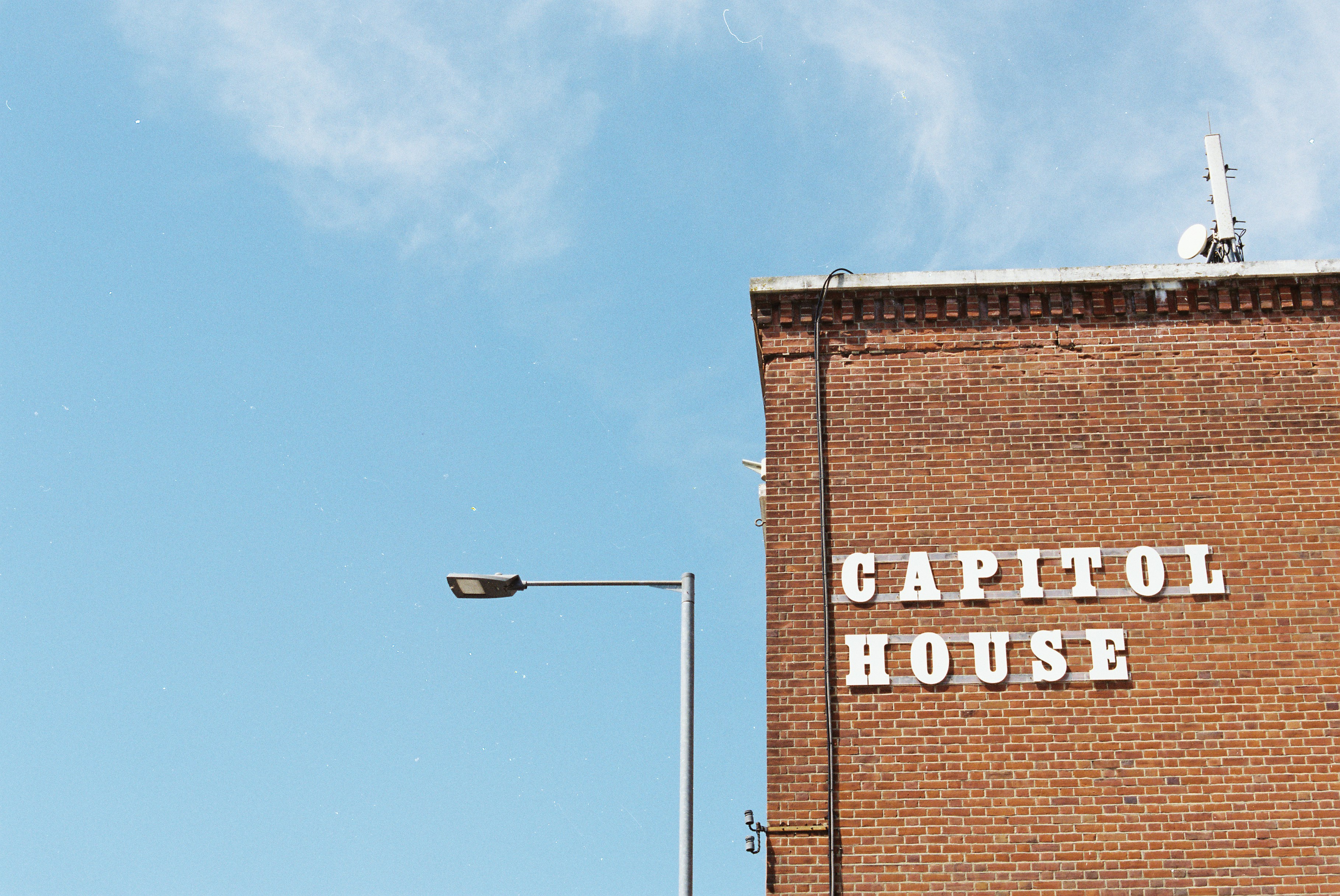 Red Brick Capitol: A Corner of Authority Under a Clear Sky