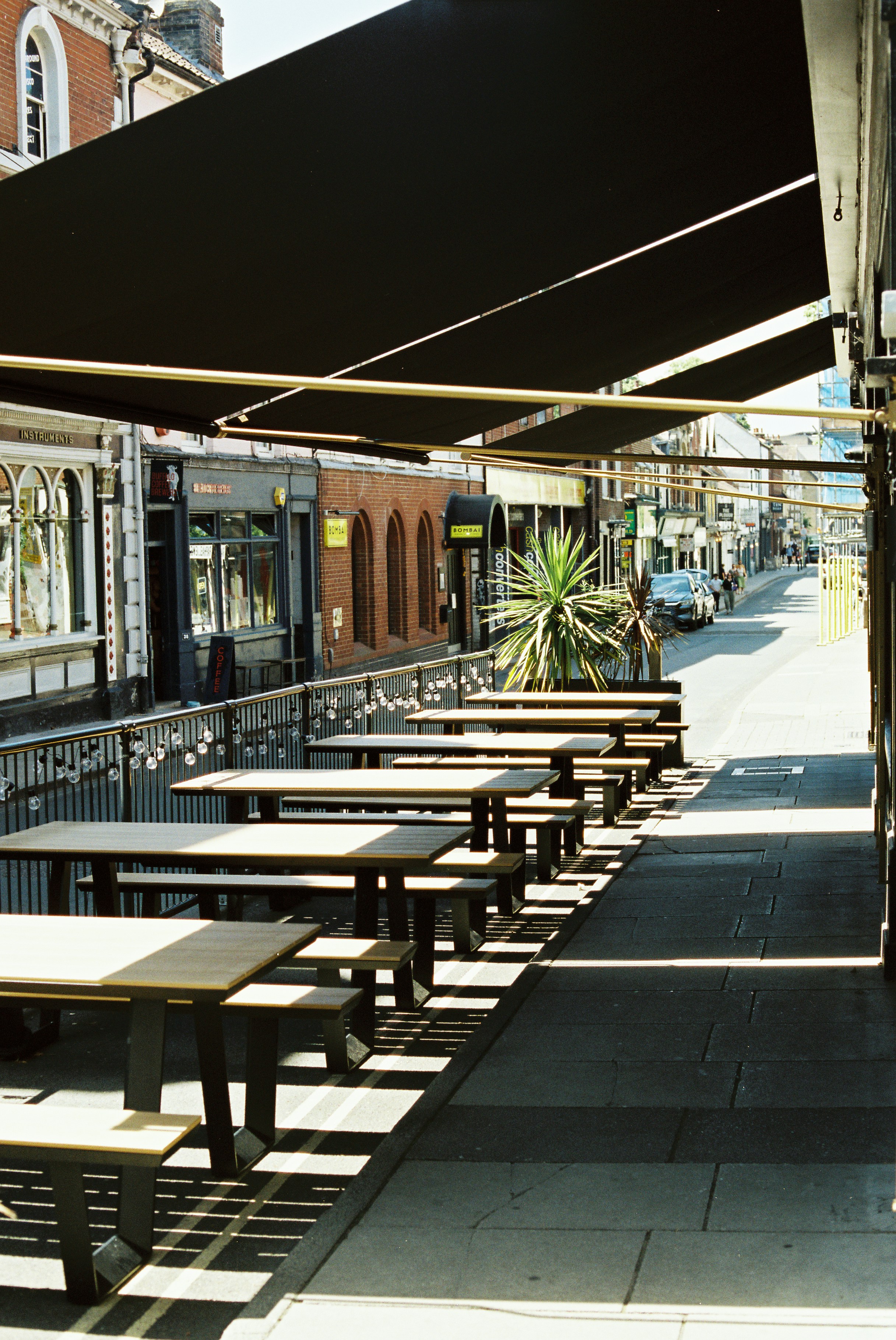 Shaded Terrace Letting Light Dapple the Street