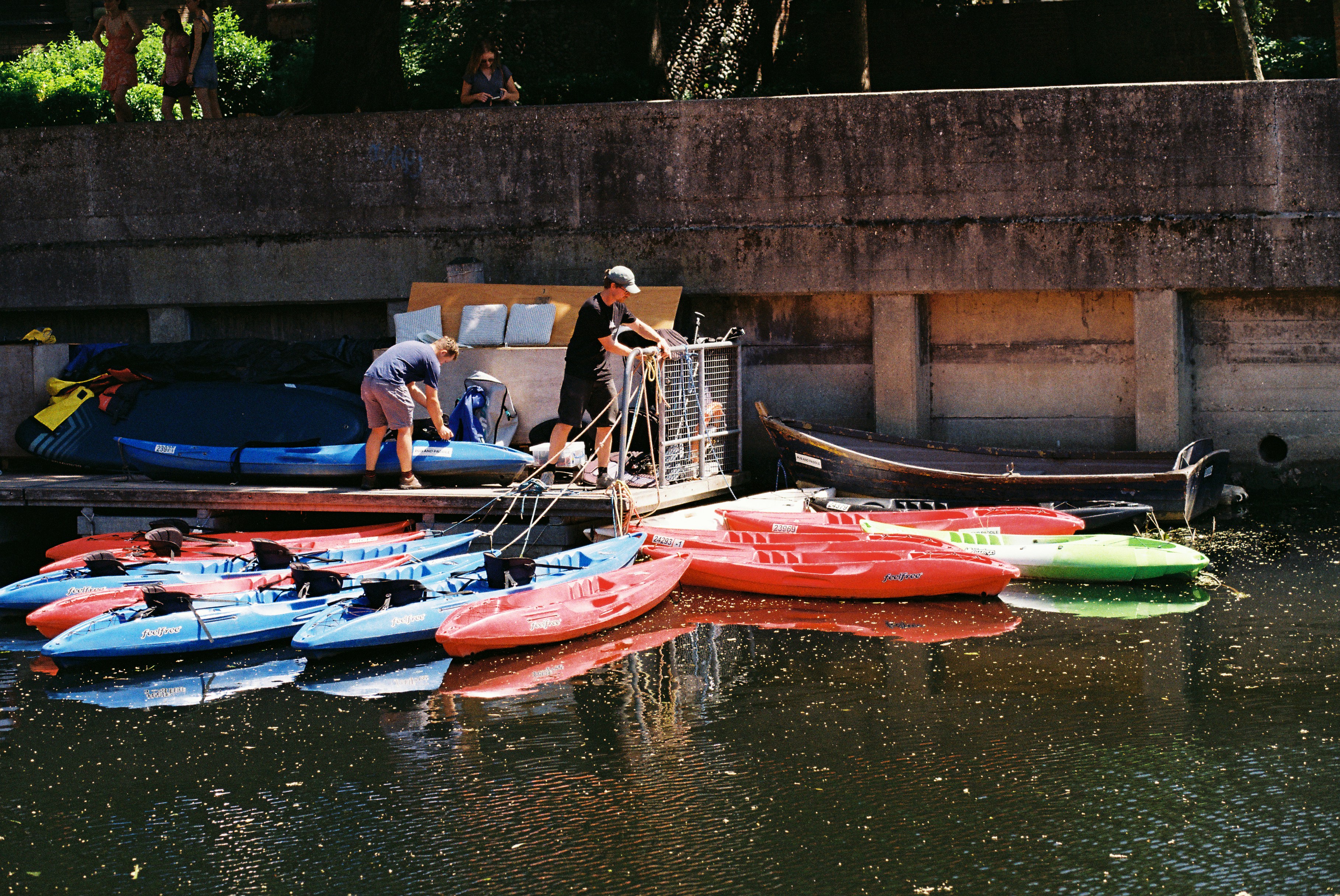 Dockside Kayaks and Crew: A Calm Morning at the Riverbank