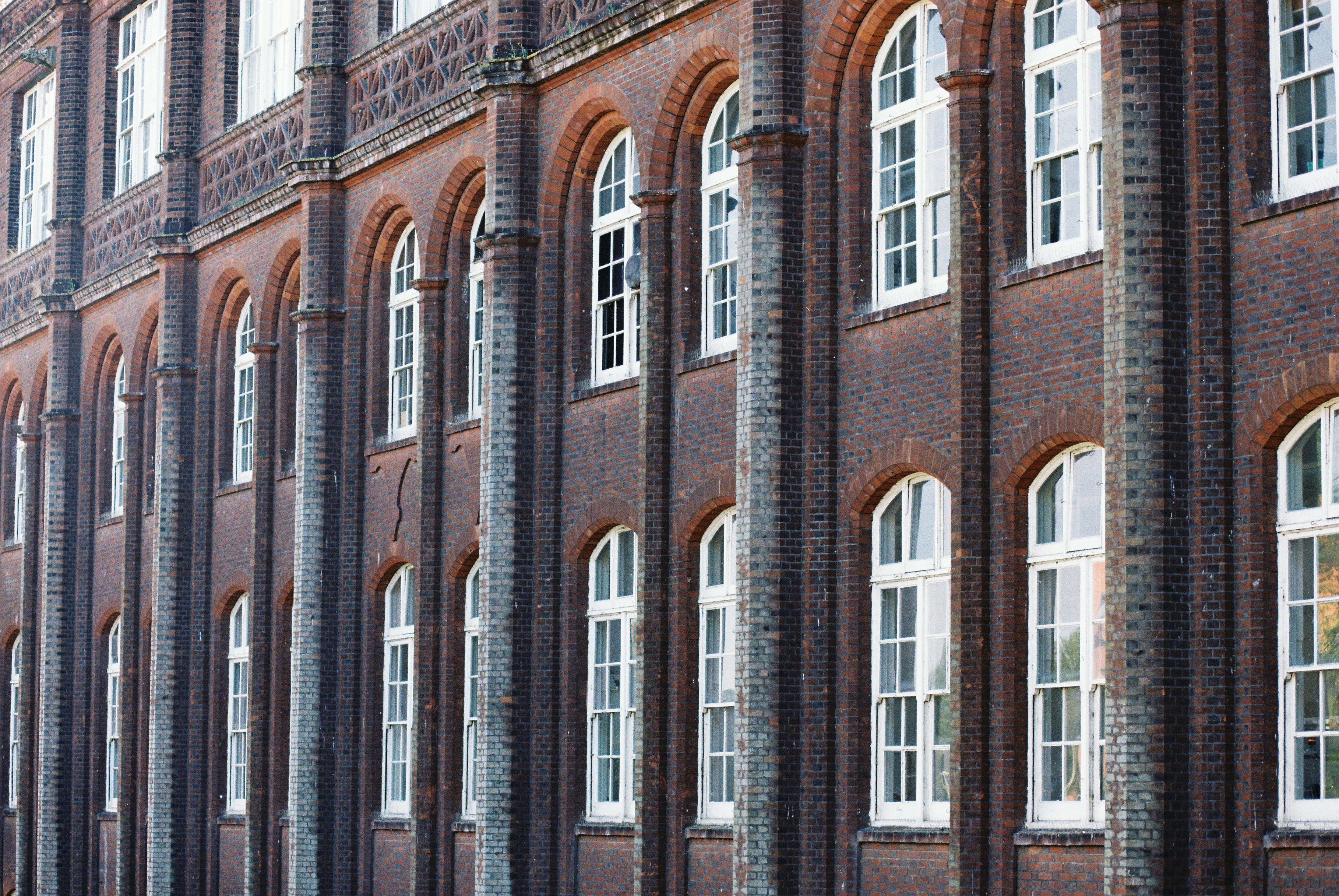 Brick Facade, Arched Windows: Repeating Architecture Along the Street