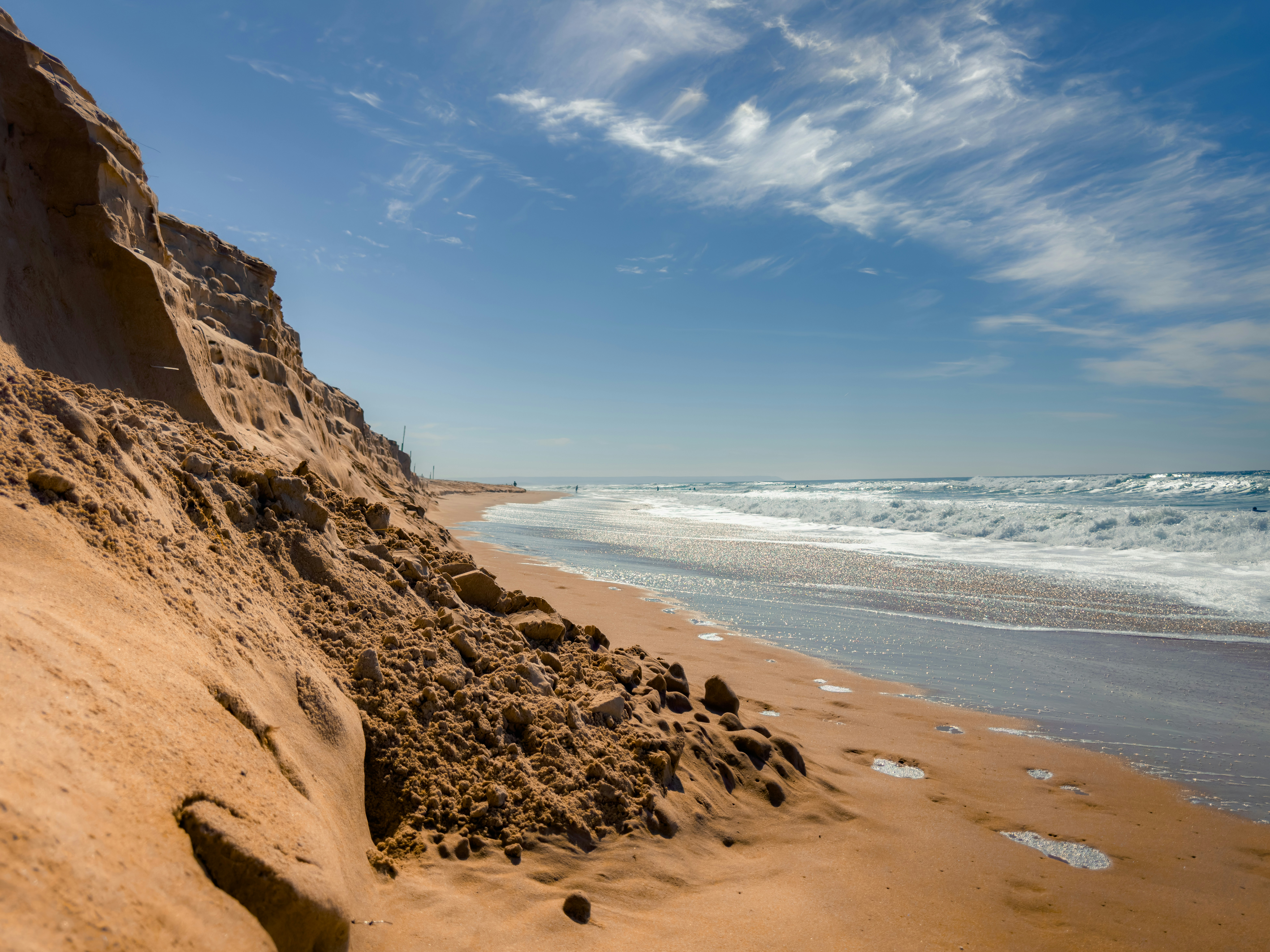 Borderline cliffs meet the rolling surf