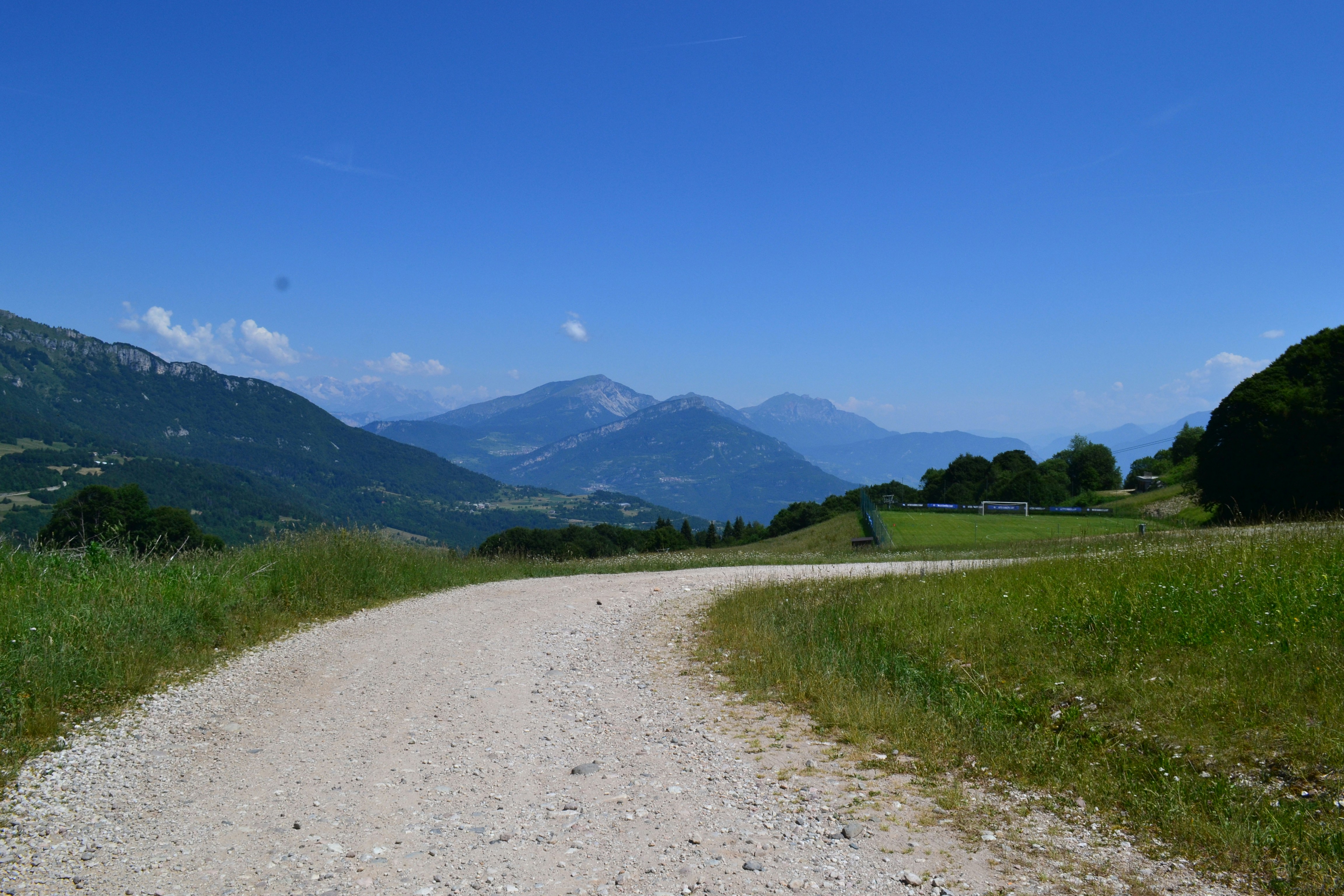 Dusty Trail Toward Blue Peaks