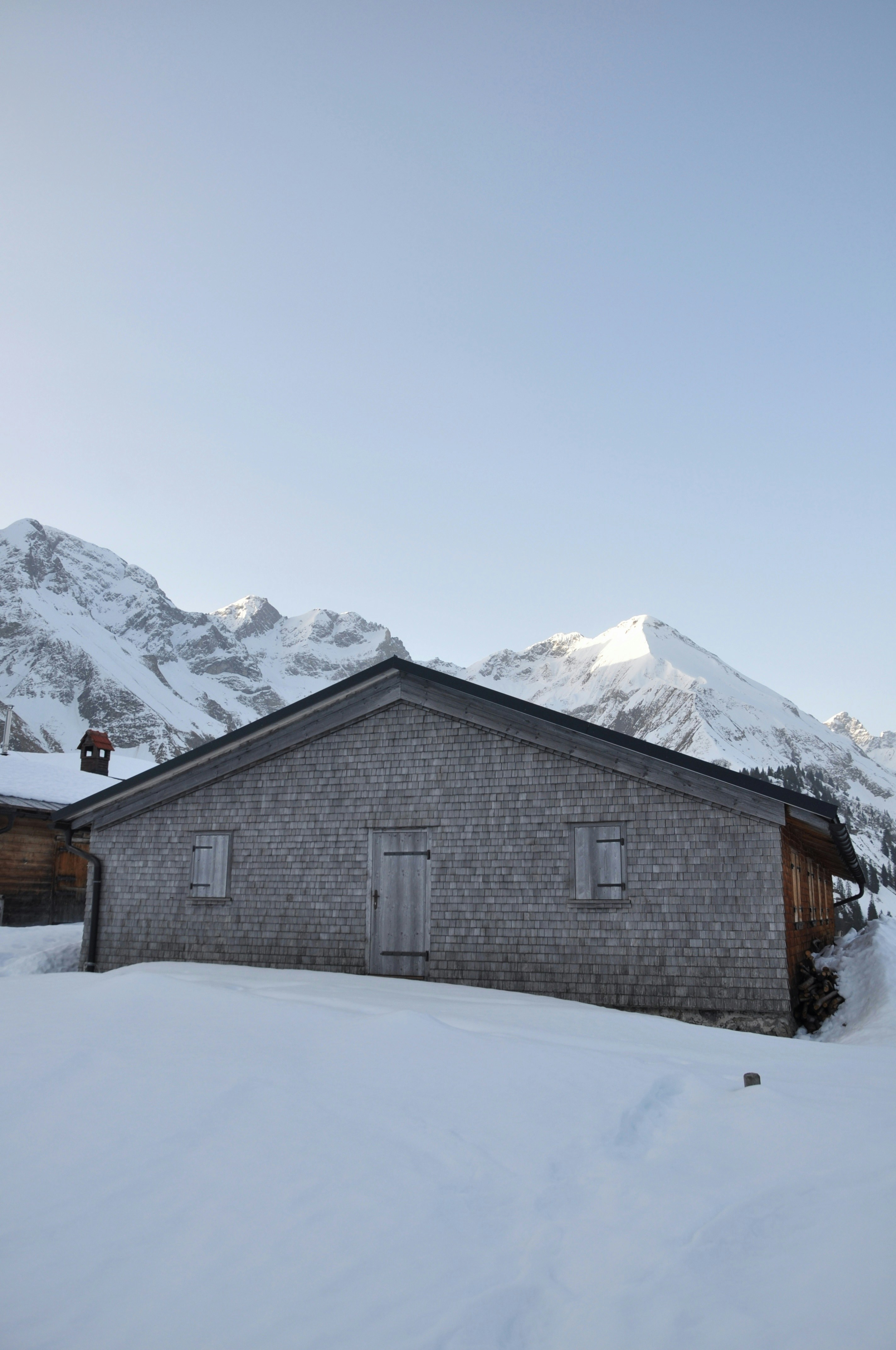 Snowbound Chalet Beneath Alpine Peaks
