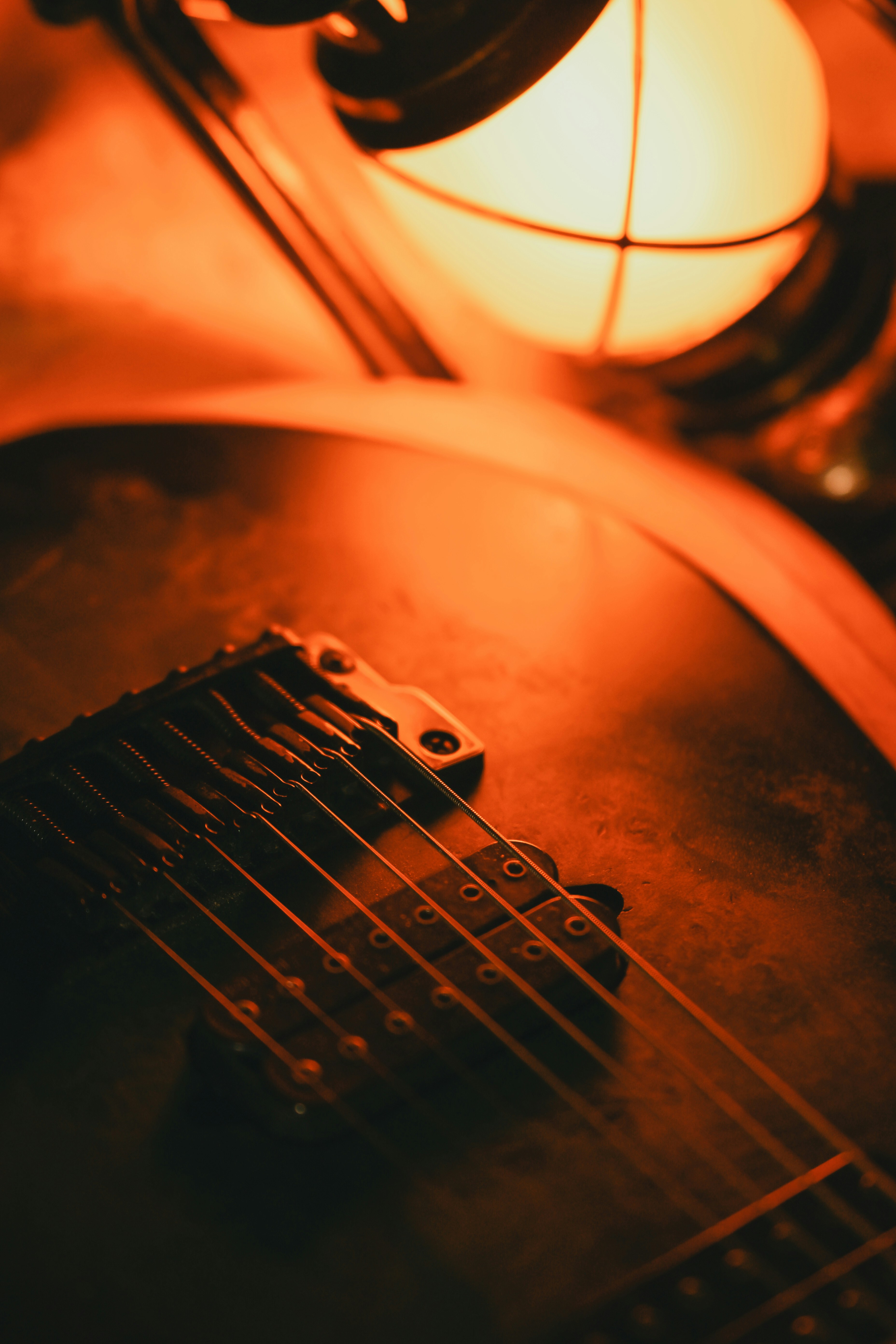 Strings in Ember: A Guitar Embered by Warm Light