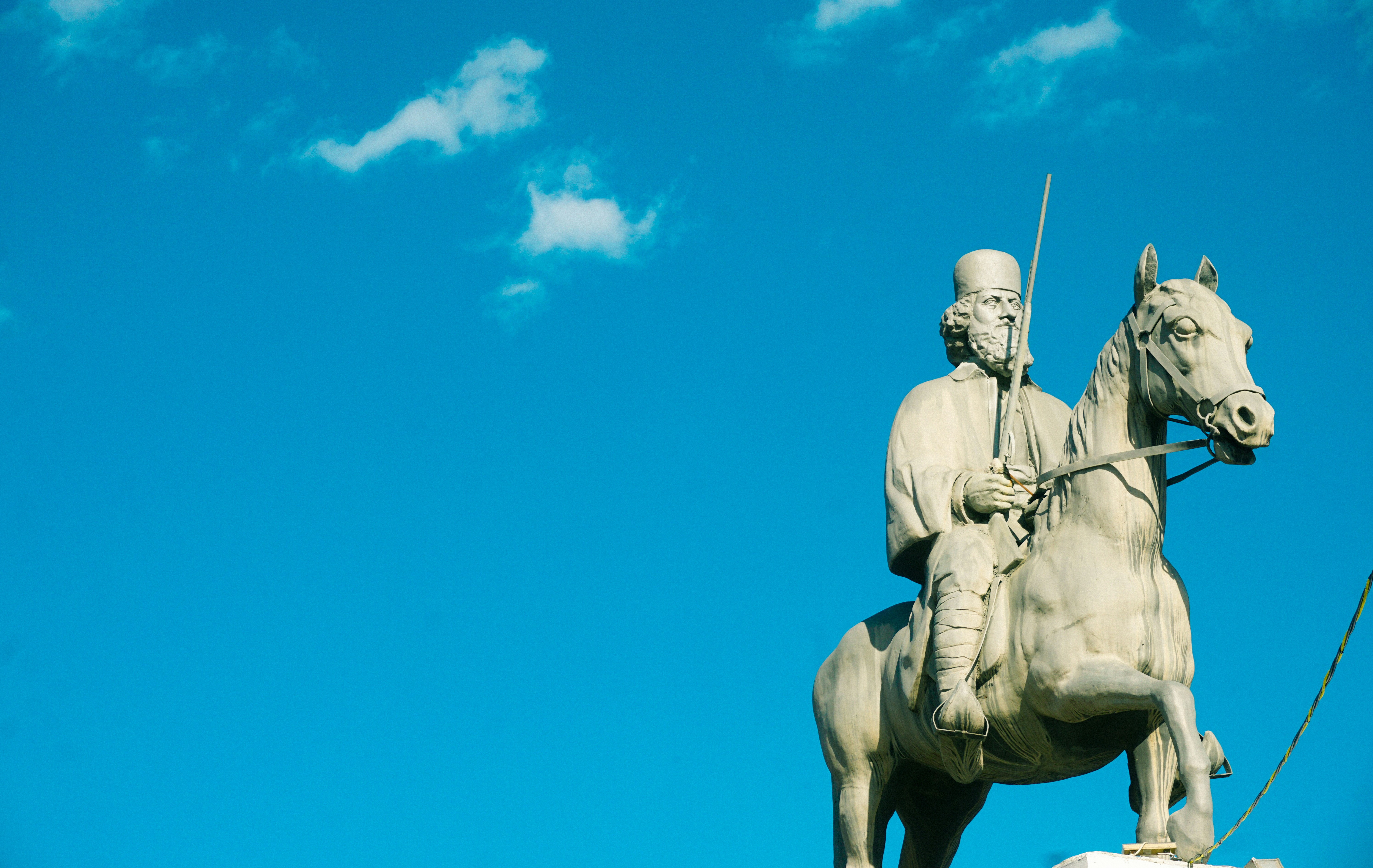 Eqestrian Sentinel: A Stoic Rider Under A Clear Deserted Sky